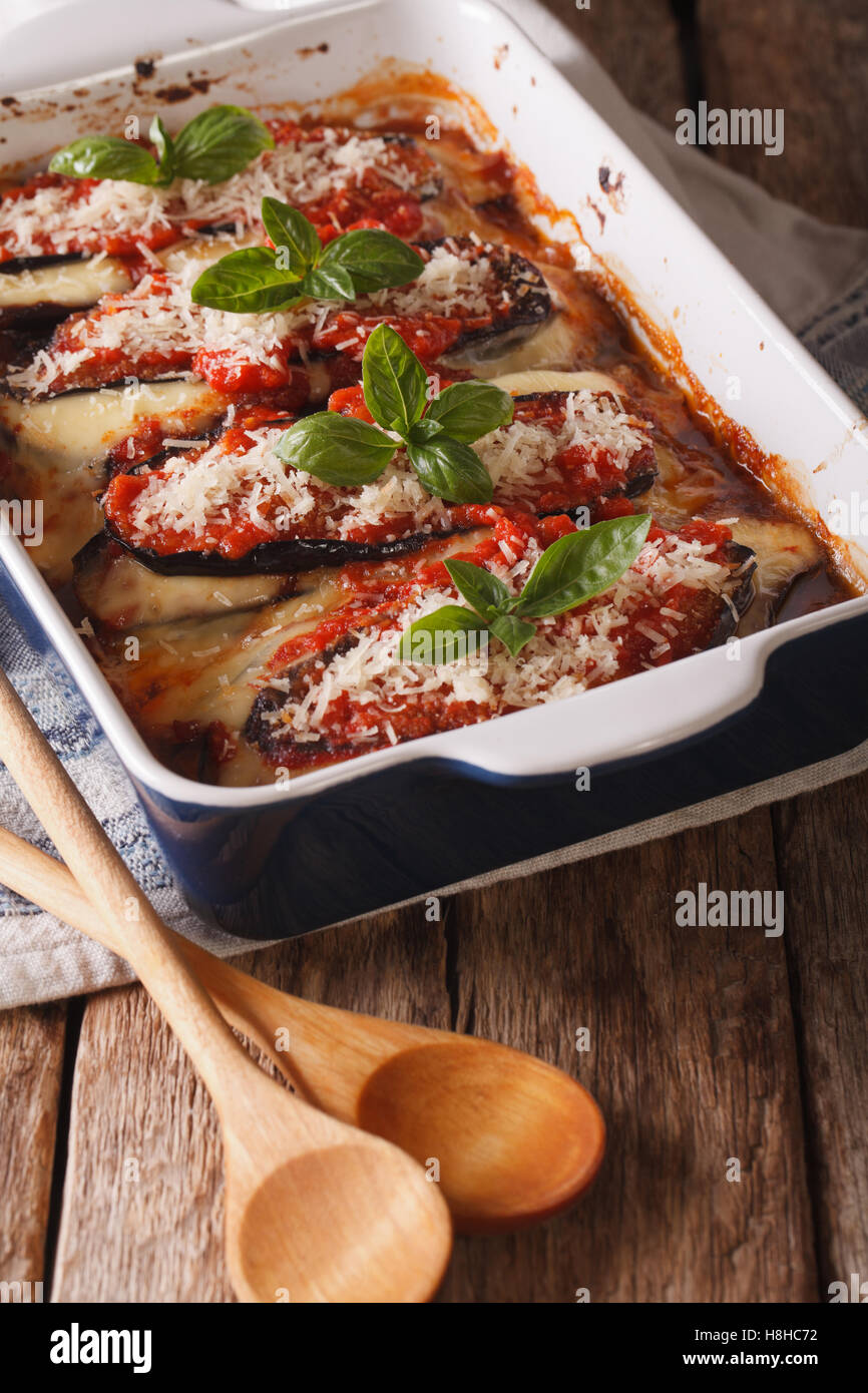 Italian eggplant Melanzane alla parmigiana close up in baking dish on ...