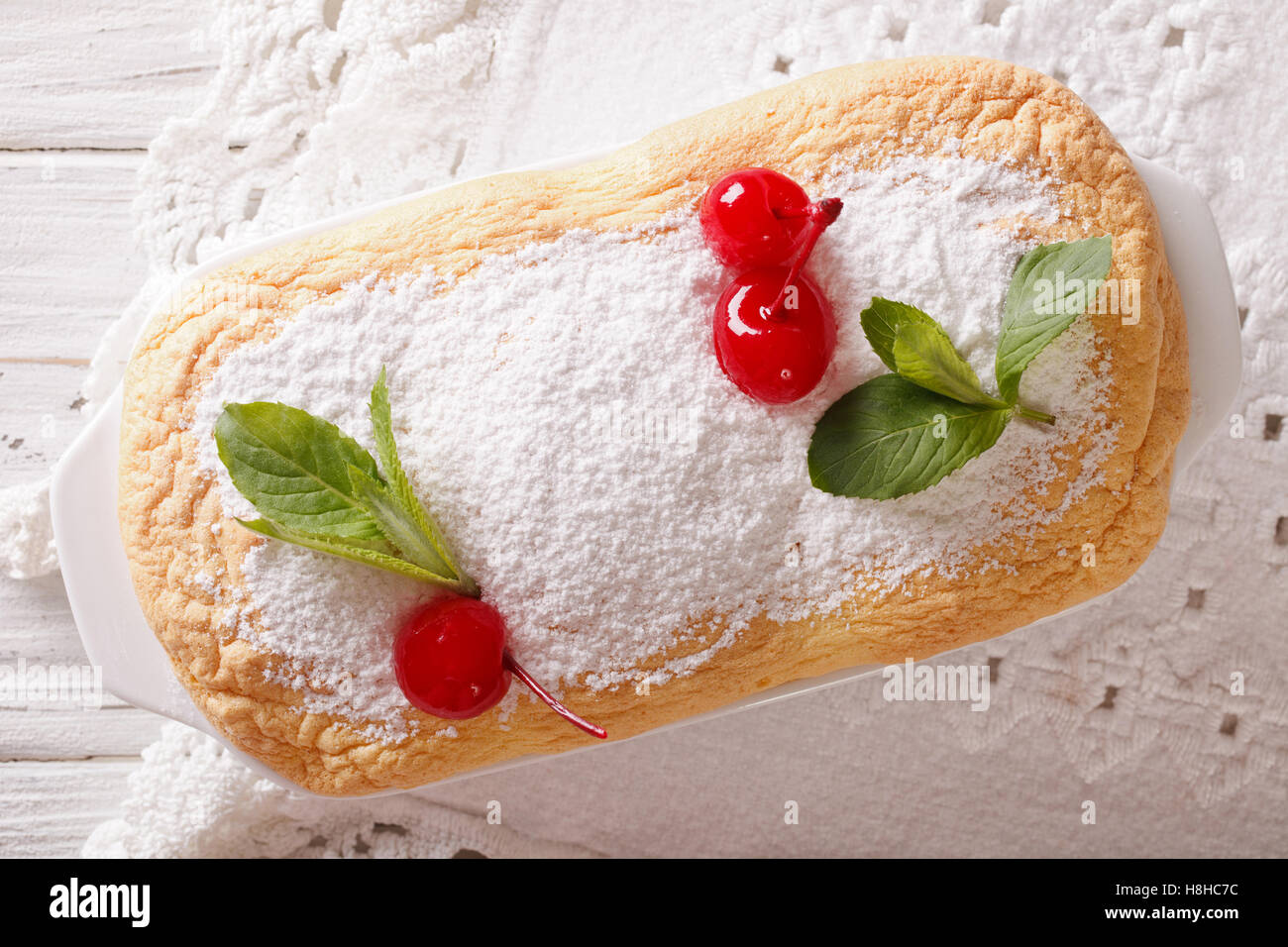 Austrian dessert Salzburger Nockerln with cherries close up in baking ...