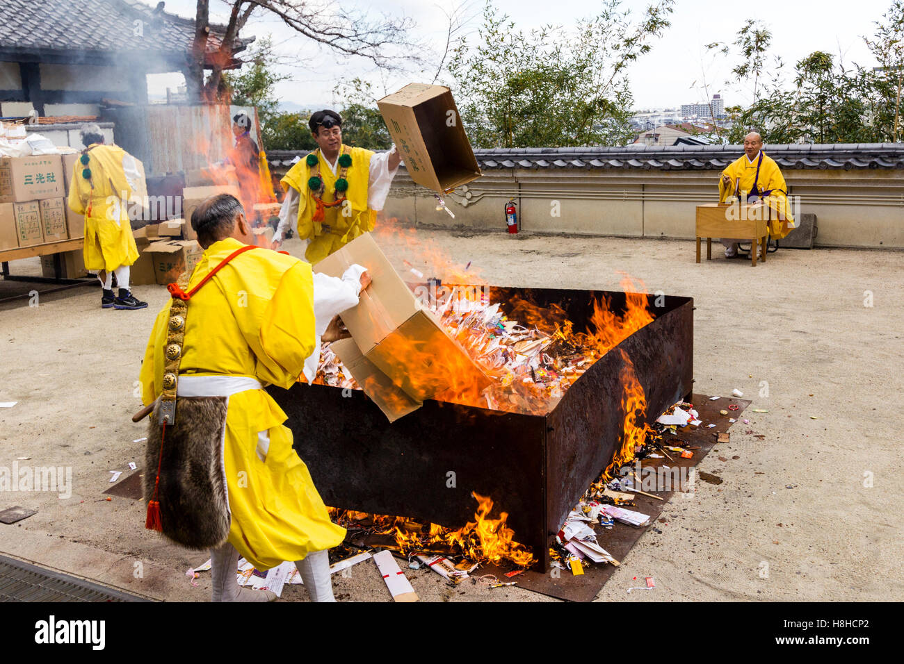 Japan, Nishinomiya, Mondo Yakujin Temple. Yamabushi priest in yellow ...