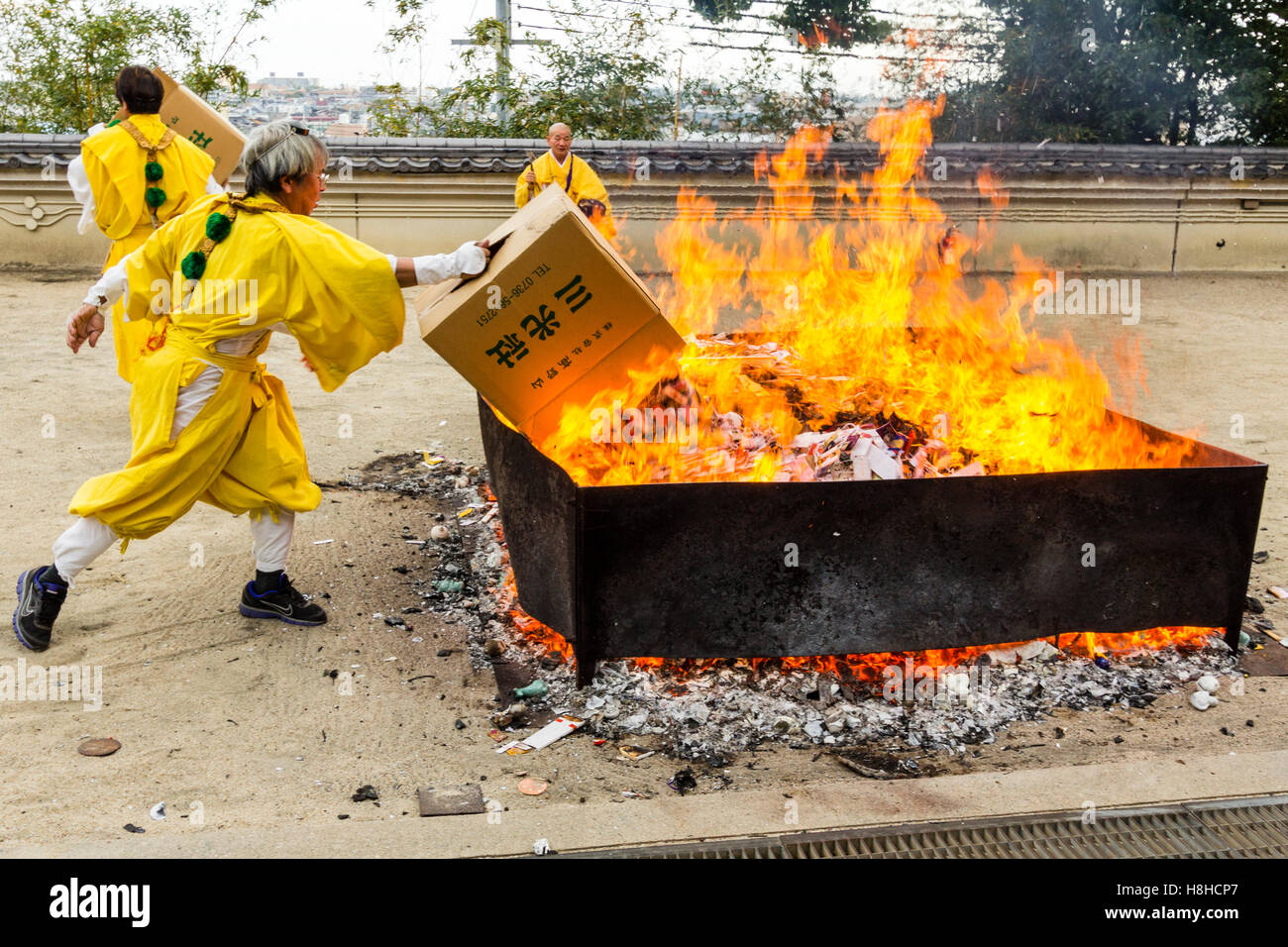 Japan, Nishinomiya, Mondo Yakujin Temple. Yamabushi priest in yellow ...