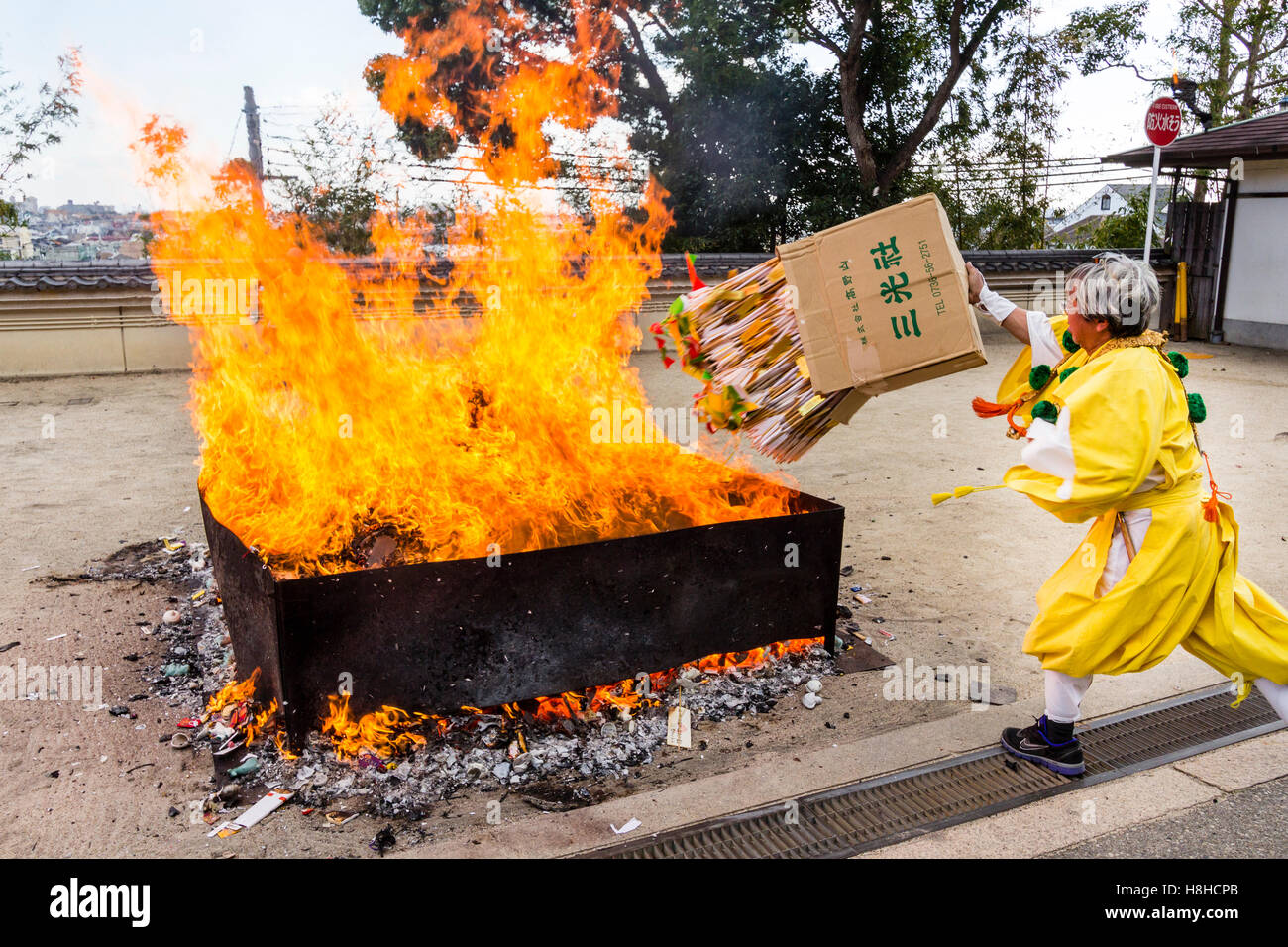Japan, Nishinomiya, Mondo Yakujin Temple. Yamabushi priest in yellow ...