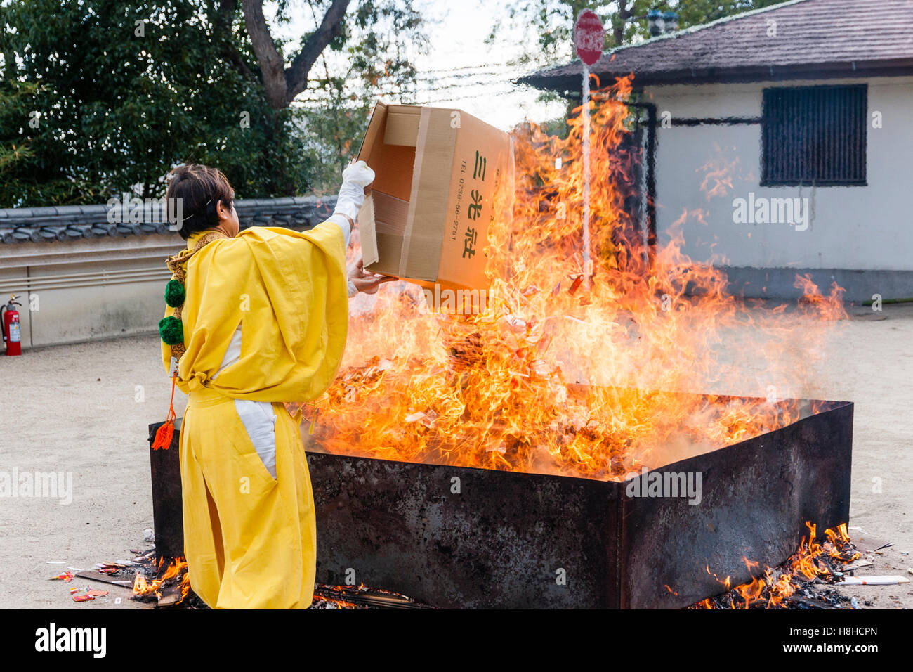 Japan, Nishinomiya, Mondo Yakujin Temple. Yamabushi priest in yellow ...