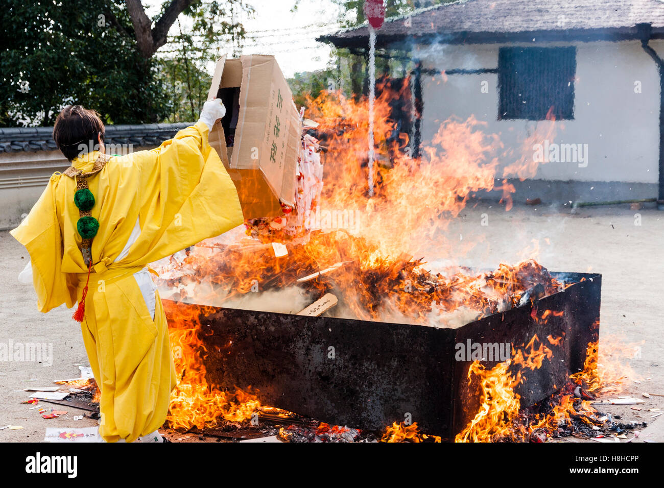 Japan, Nishinomiya, Mondo Yakujin Temple. Yamabushi priest in yellow ...