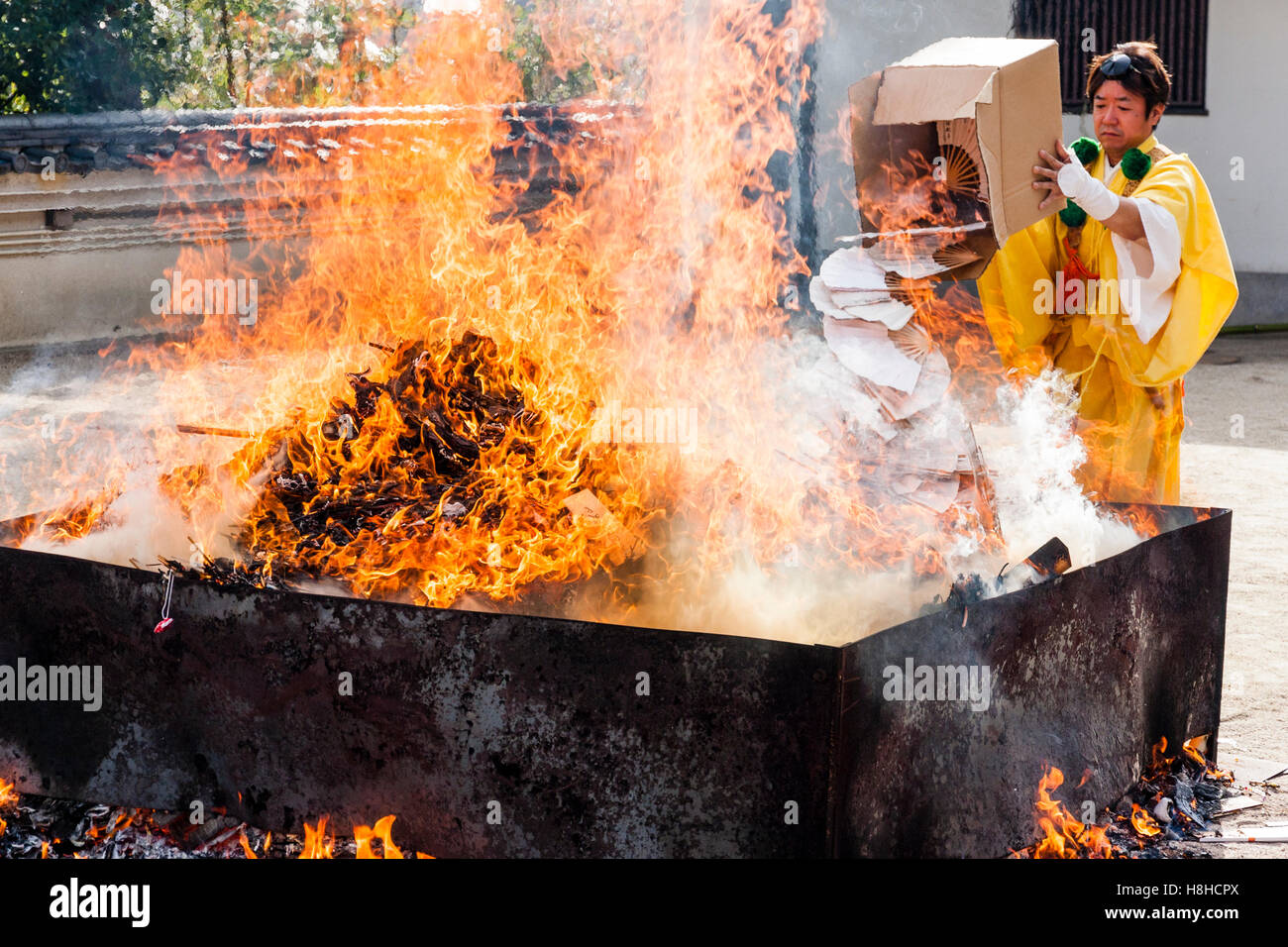 Japan, Nishinomiya, Mondo Yakujin Temple. Yamabushi priest in yellow ...