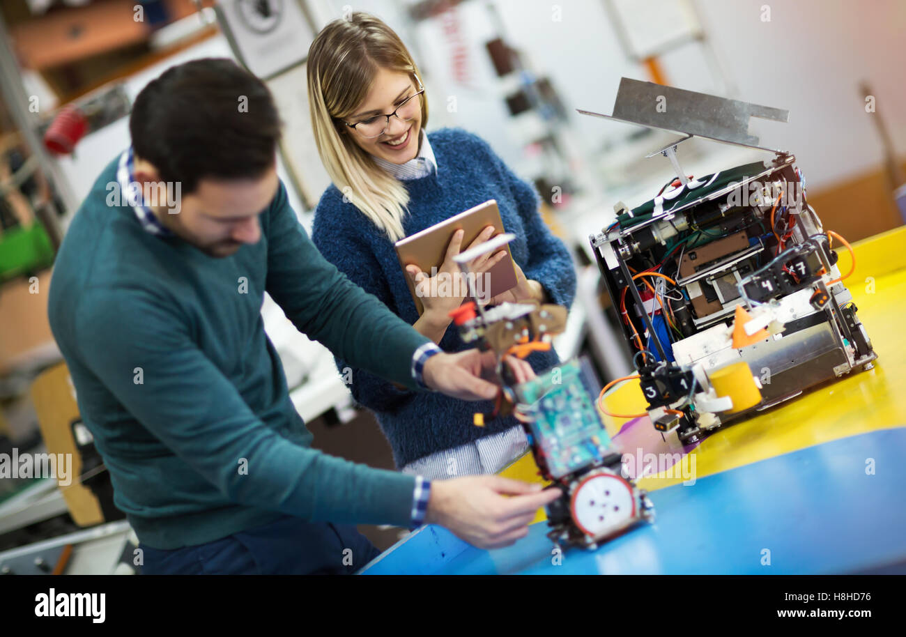 Engineering robotics class teamwork by students Stock Photo - Alamy