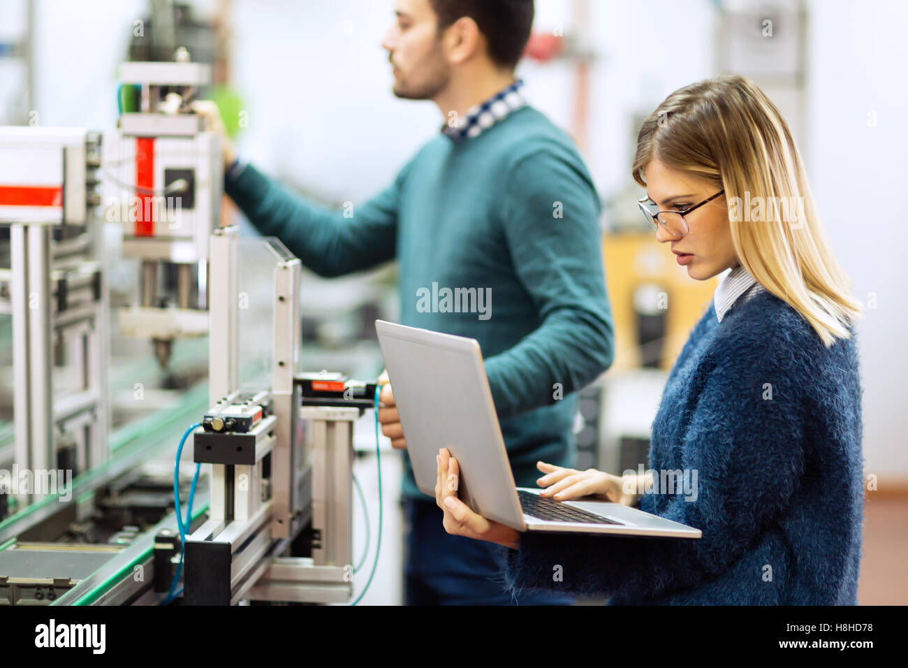 Engineering robotics class teamwork by students Stock Photo - Alamy