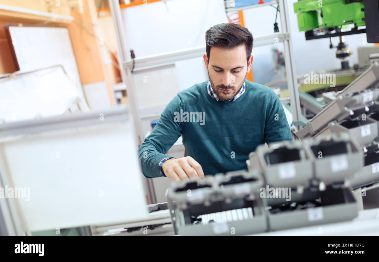 Students working on engineering class project Stock Photo - Alamy