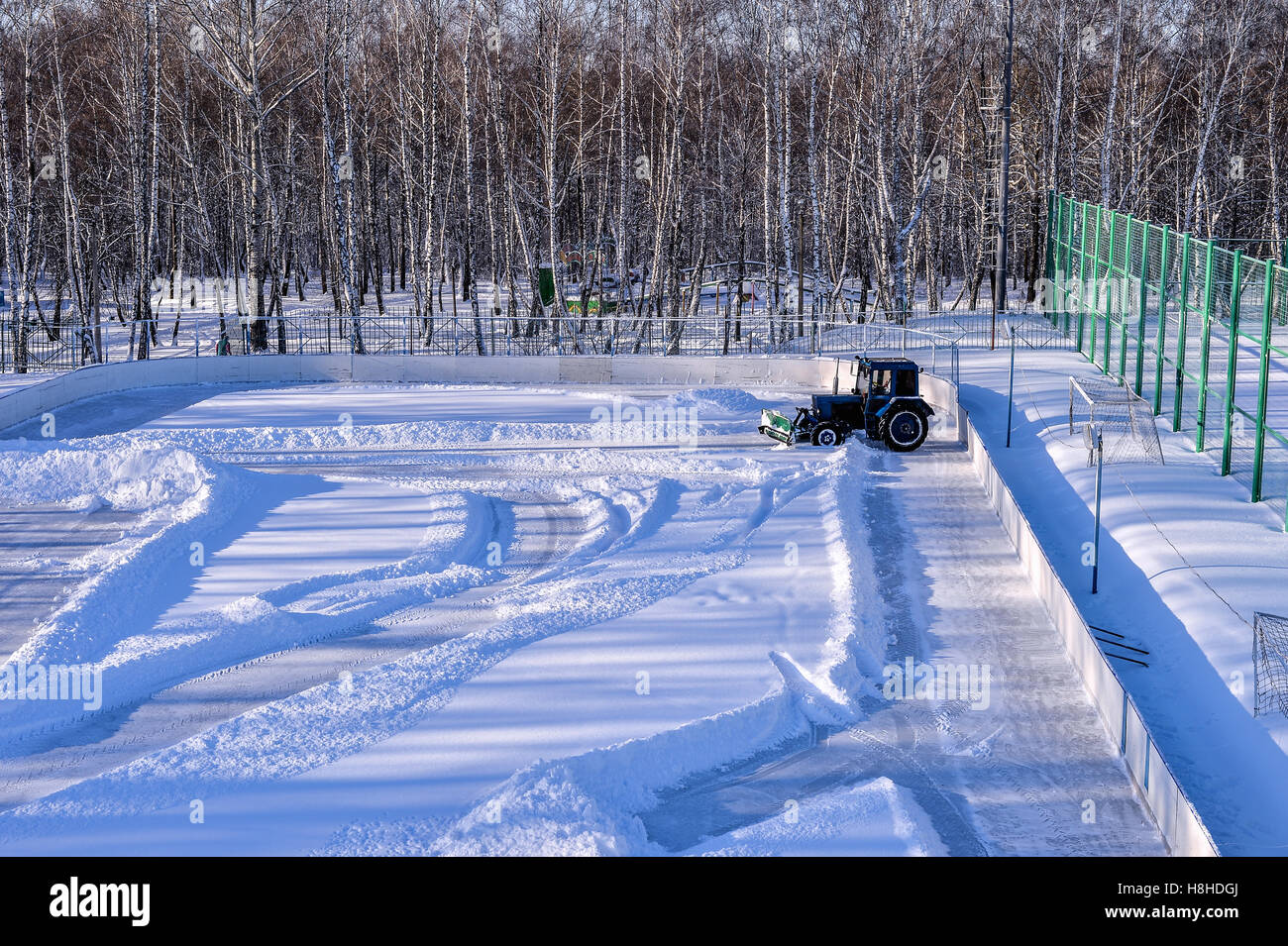 Removing snow from the pitch Stock Photo - Alamy