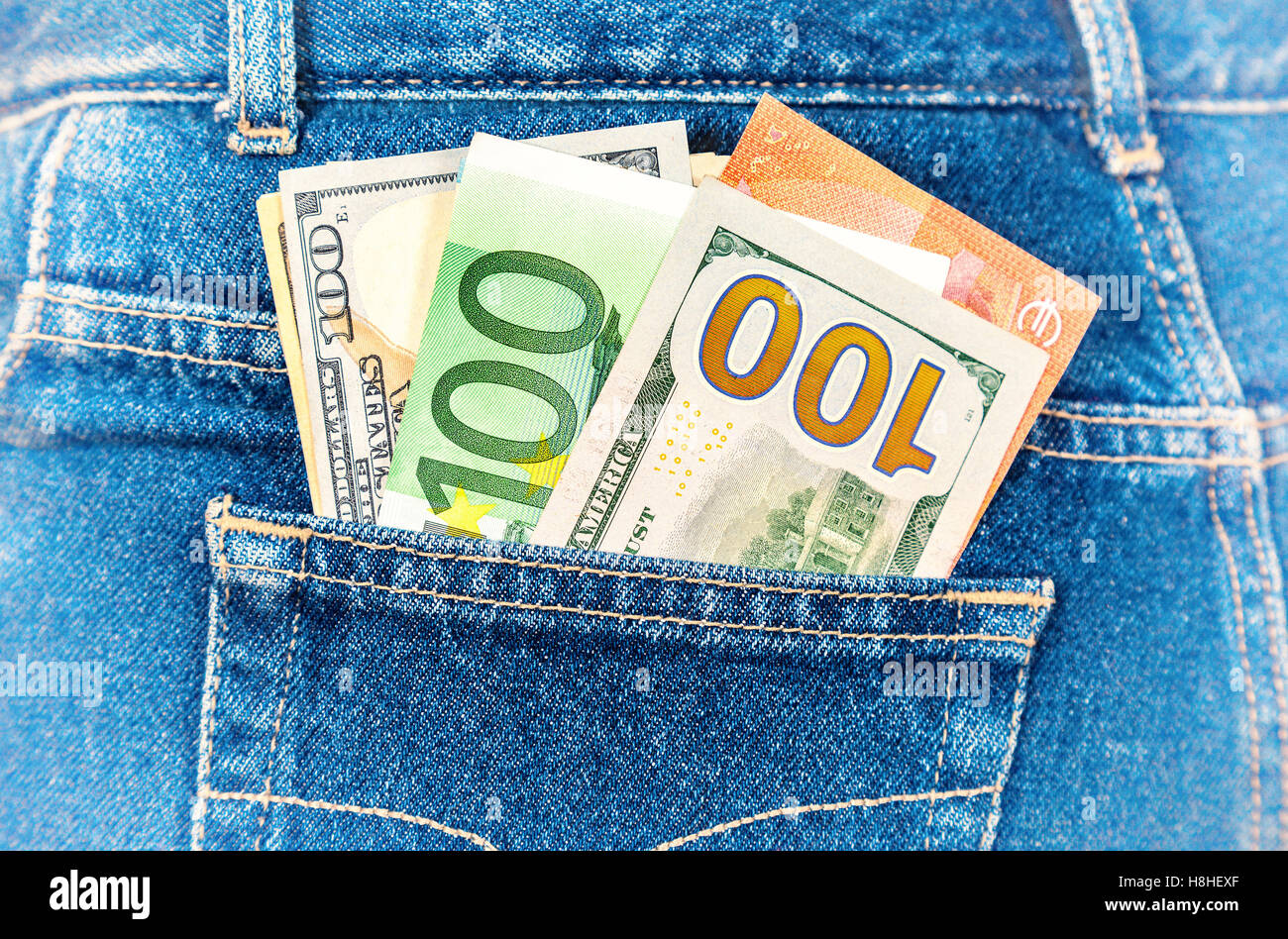 Euro and american currency, money in jeans pocket for travel and ...
