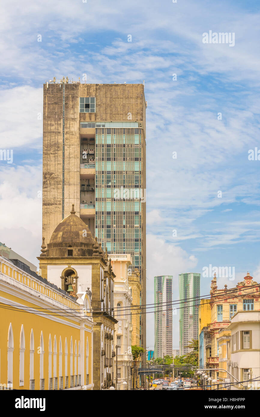 Low angle view of eclectic style buildings against blue sky in Recife ...