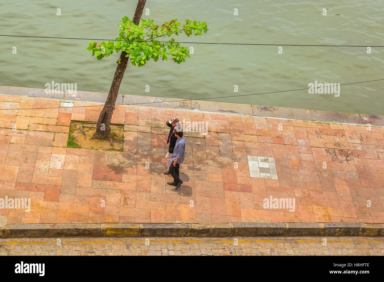 RECIFE, BRAZIL, JANUARY - 2016 - Urban scene top view of two men ...