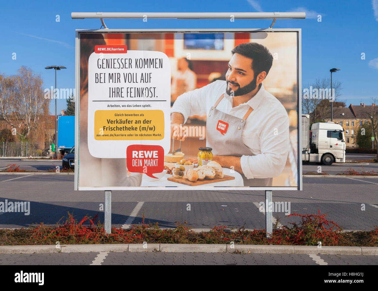 BURG / GERMANY - NOVEMBER 13, 2016: REWE supermarket info poster stands ...
