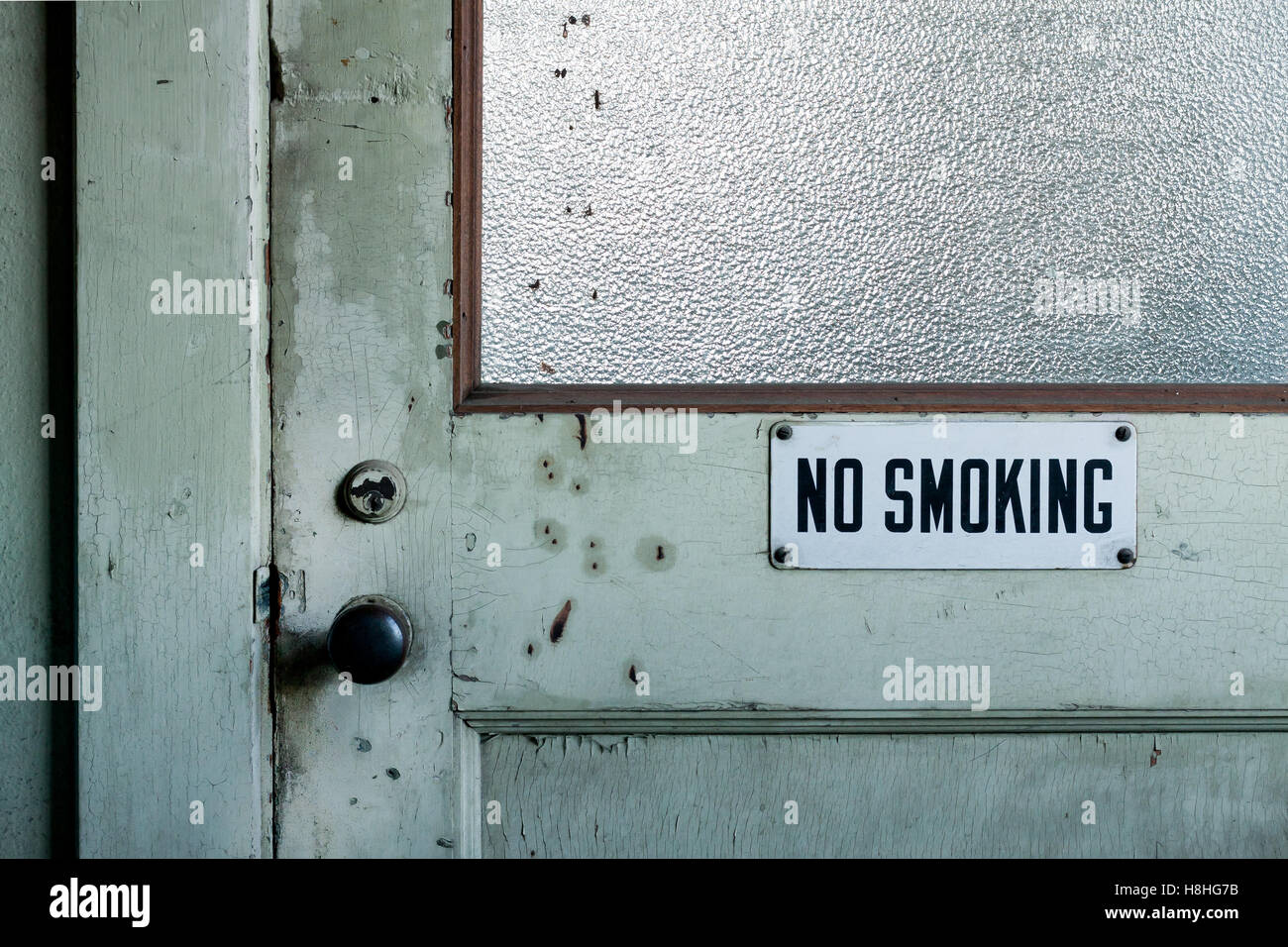 No Smoking sign on old factory door Stock Photo - Alamy