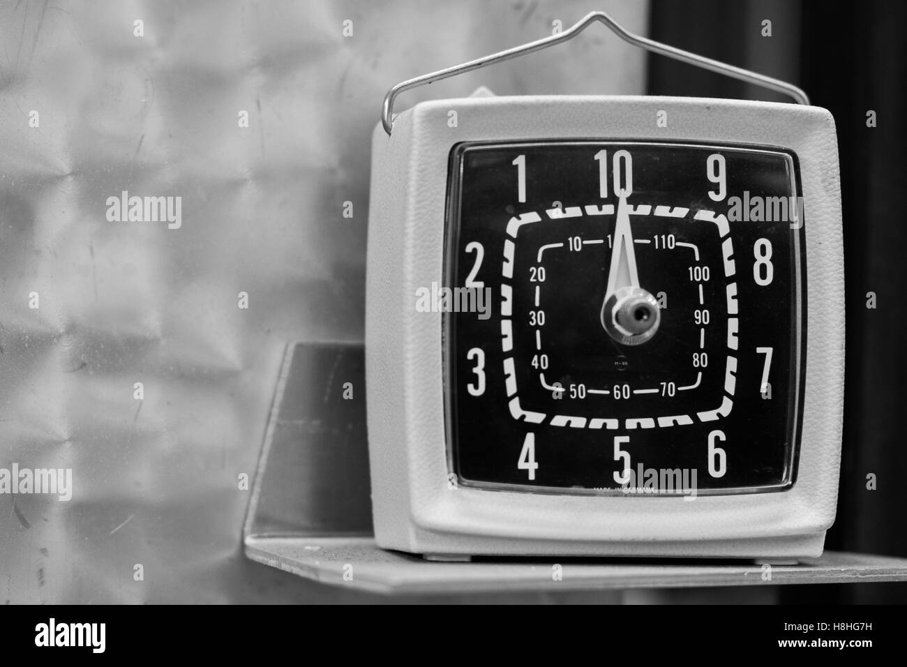 Vintage industrial factory timer on metal shelf - metallic background ...