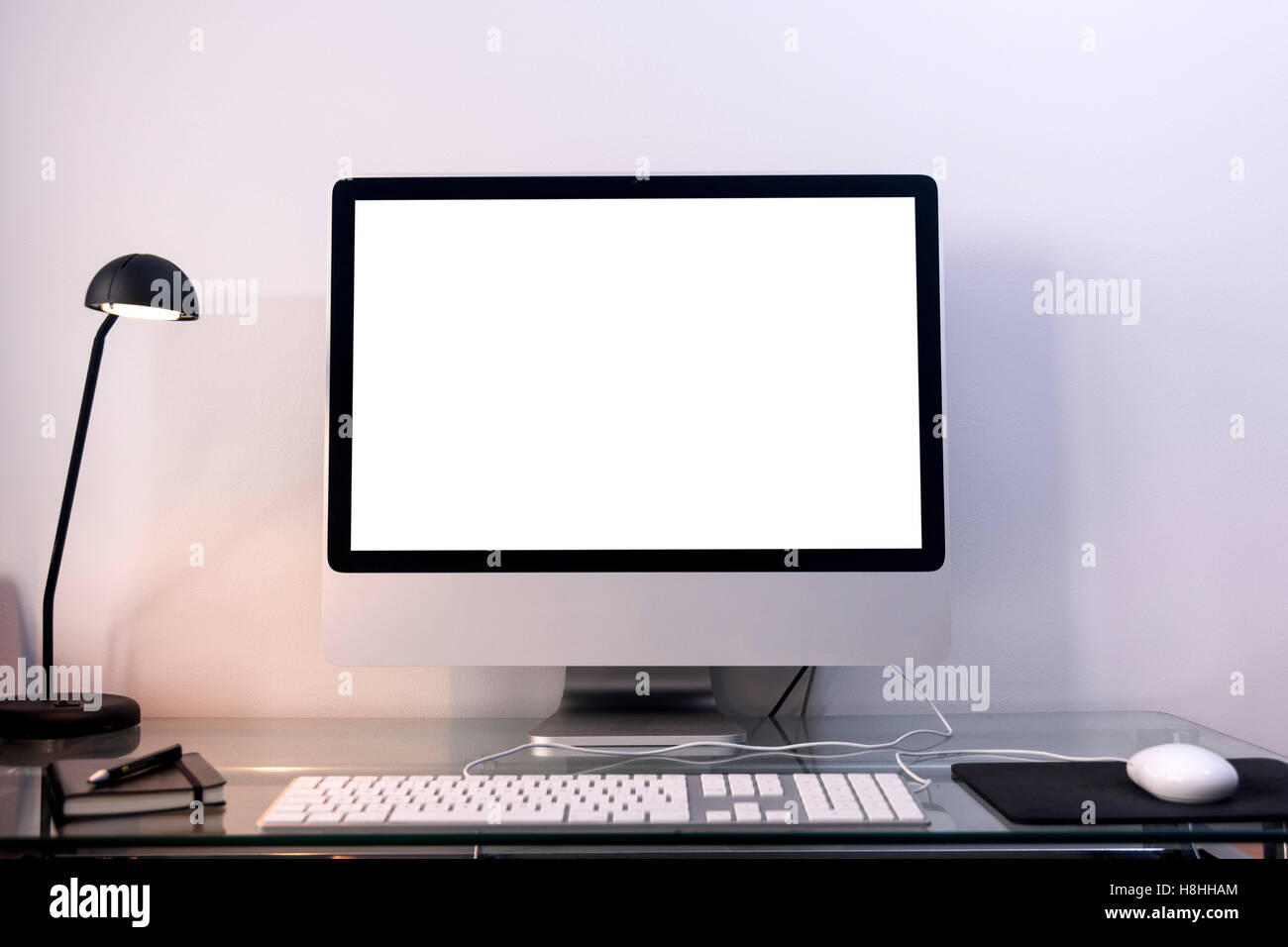 modern flat screen computer on a glass desk with blank screen Stock ...
