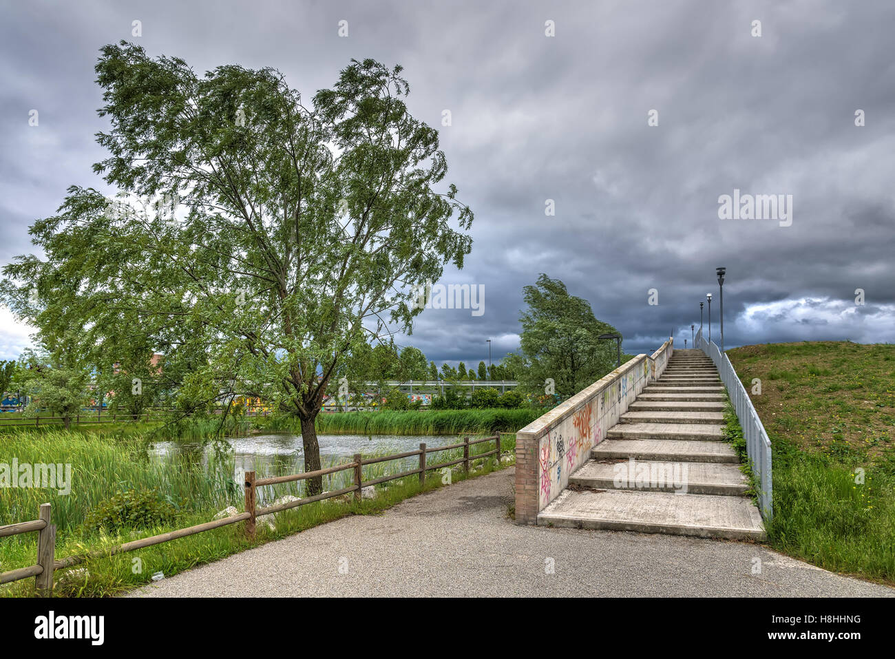 A city park with under heavy wind and stormy sky Stock Photo - Alamy