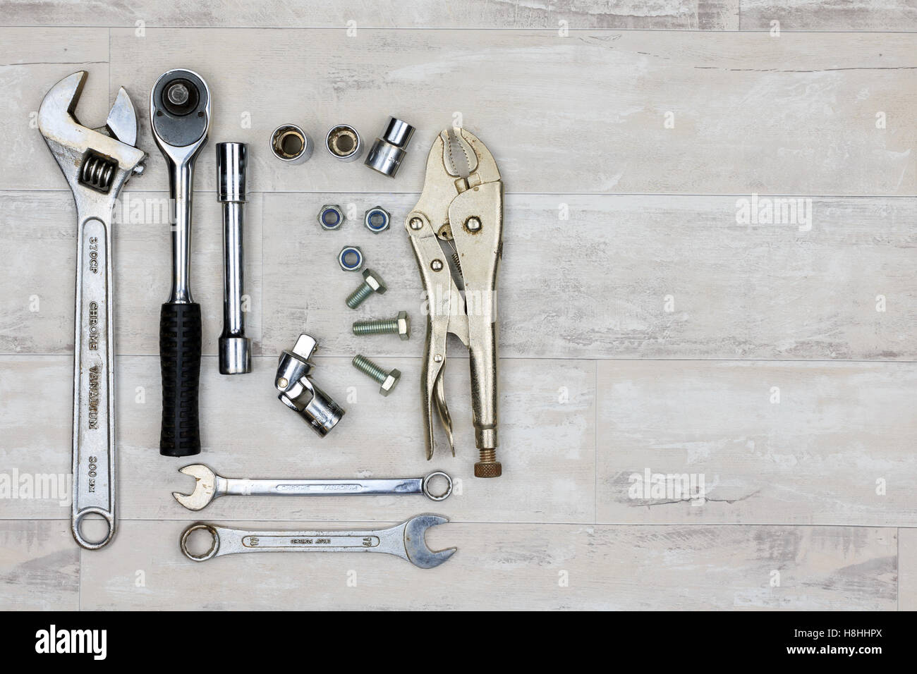 Selection of hand wrenches, sockets, spanners and vice grips on a ...