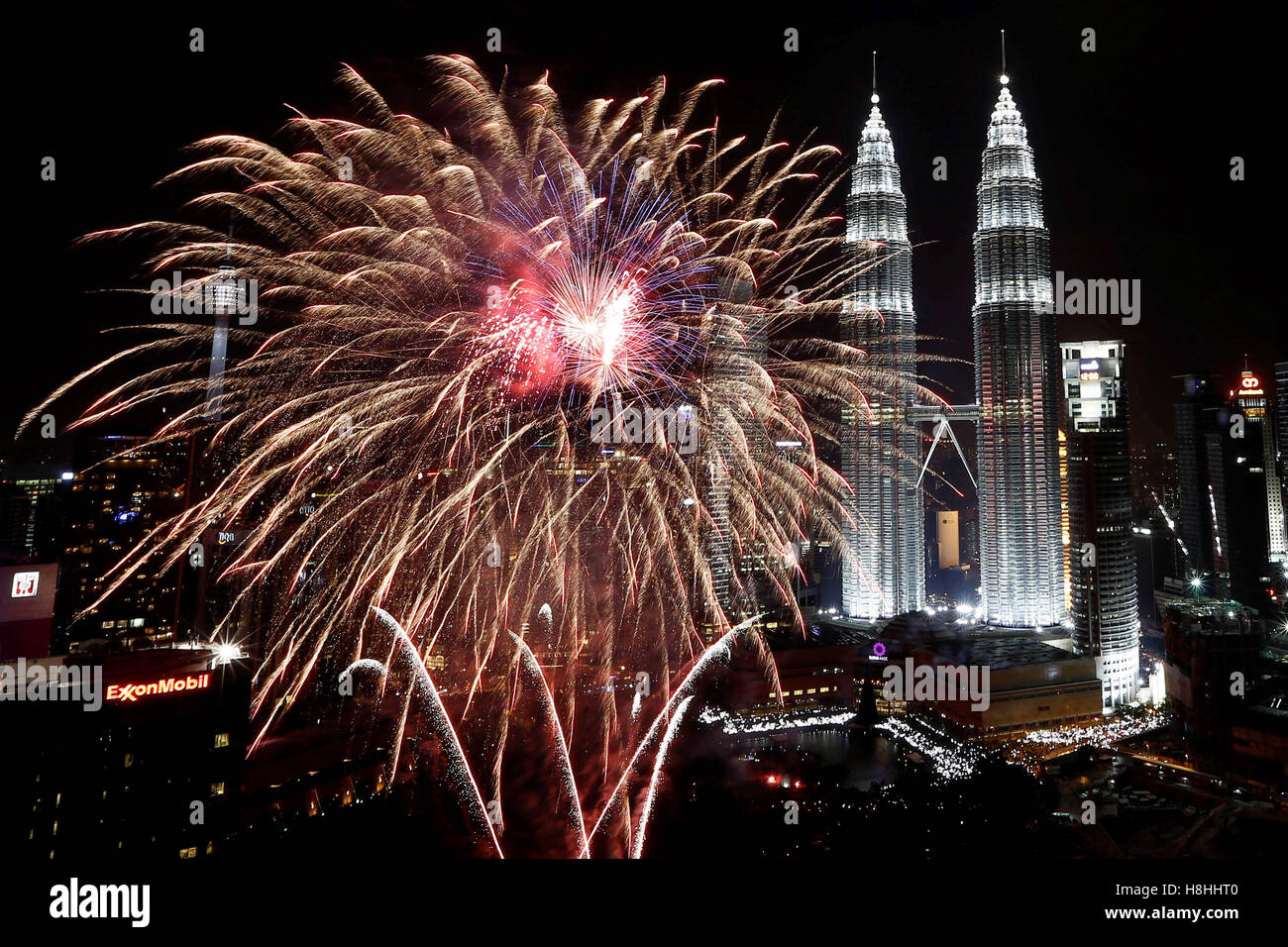 Fireworks explode near Malaysia's landmark Petronas Twin Towers during ...