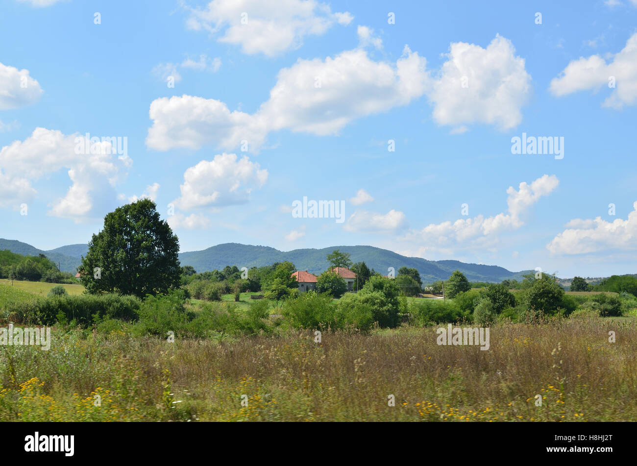 Two old village houses in picturesque landscape in central Serbia Stock ...