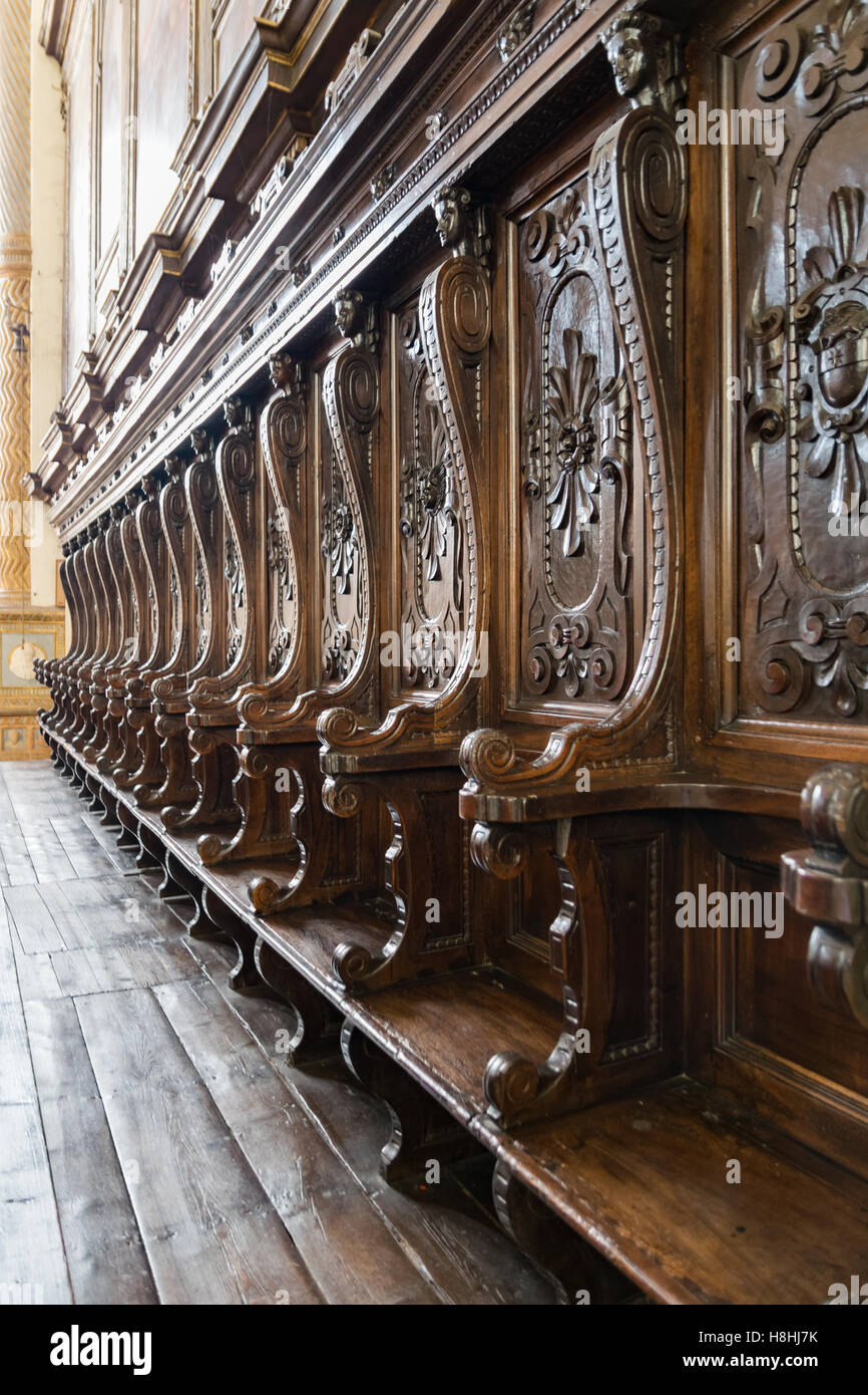 Details of wooden pews beside the altar of a medieval church Stock ...