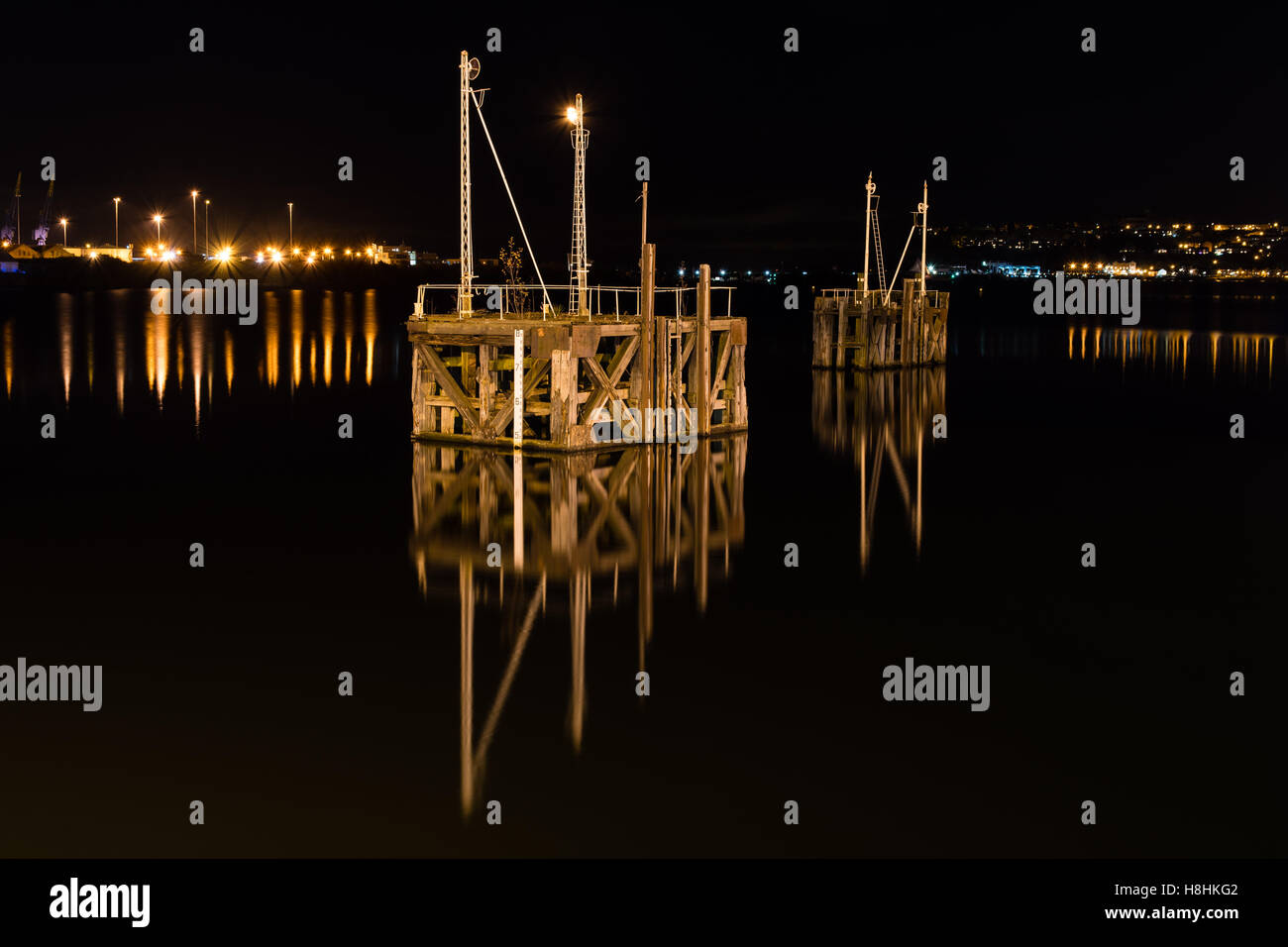 Timber structures, or dolphins, in Cardiff Bay, Wales. Wooden ...