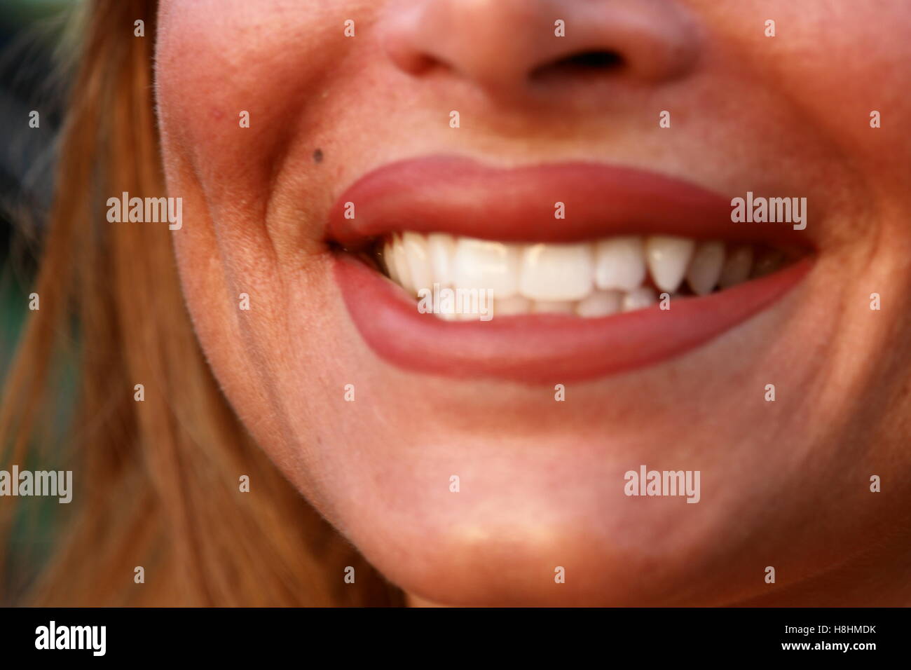 Close up of a woman's smile Stock Photo - Alamy