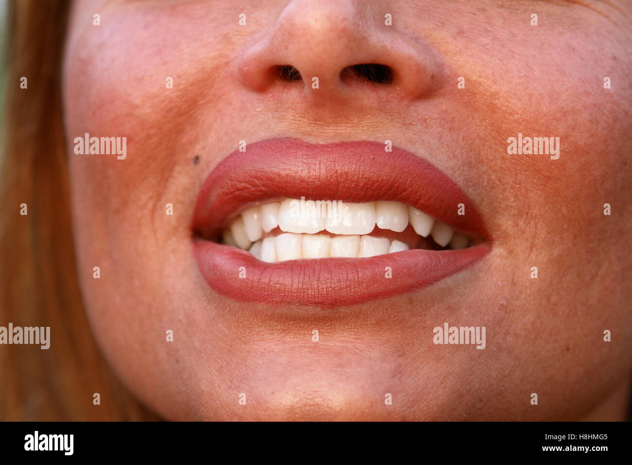 Close up of a woman's smile Stock Photo - Alamy