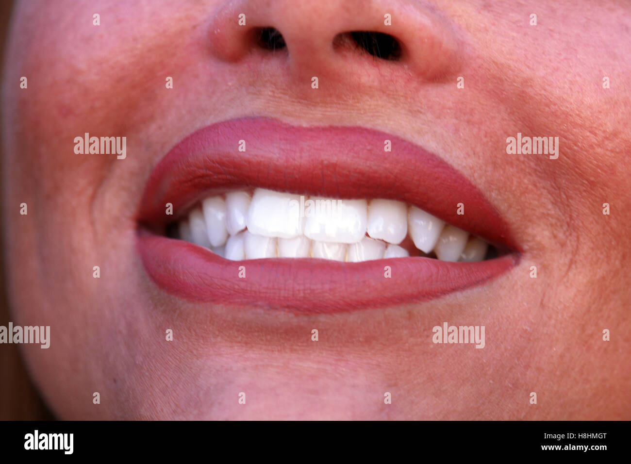 Close up of a woman's smile Stock Photo - Alamy