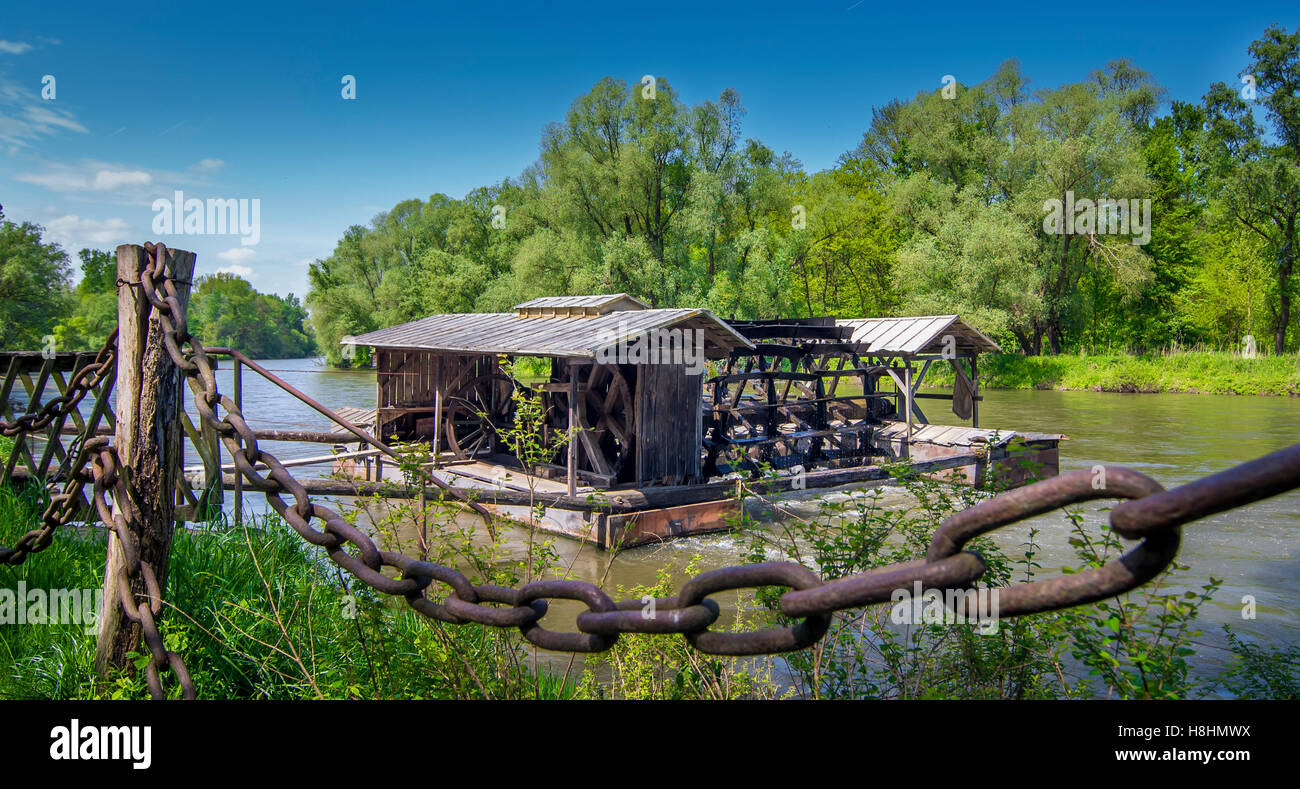Traditional vintage mill on Mura river, Slovenia. The mill is floating ...