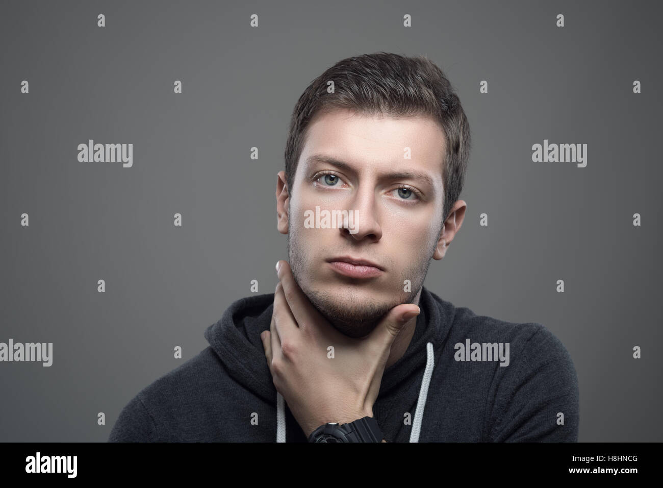 Hand under chin, looking at camera High Resolution Stock Photography ...