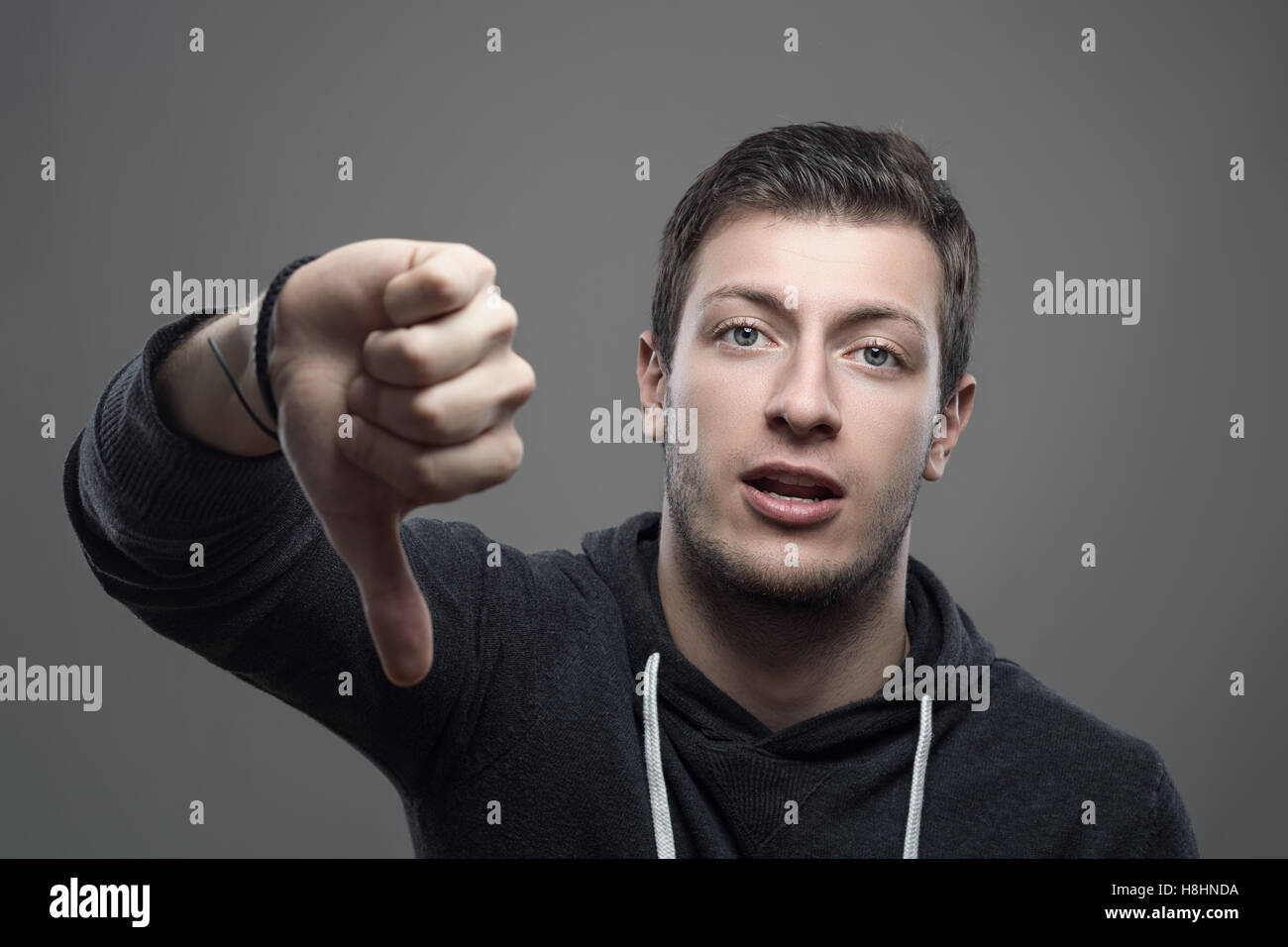 Man showing thumb down hi-res stock photography and images - Alamy