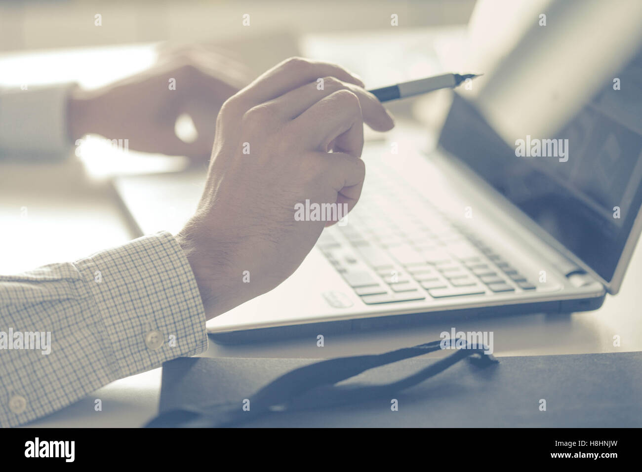 Working at home with laptop man Stock Photo - Alamy