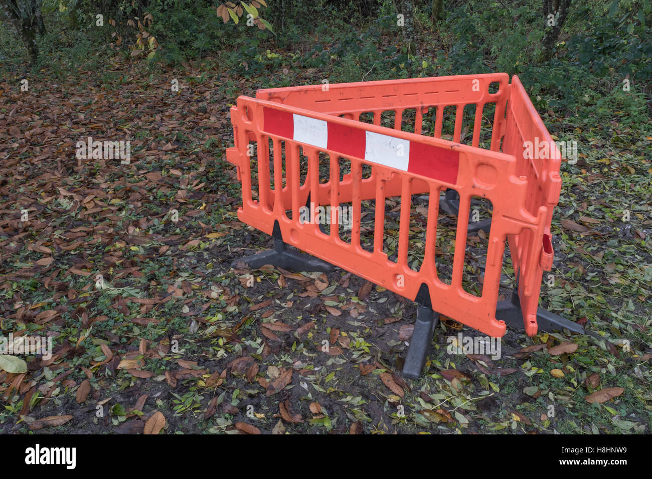 Orange barrier safety fencing arranged in a triangle. For putting up ...