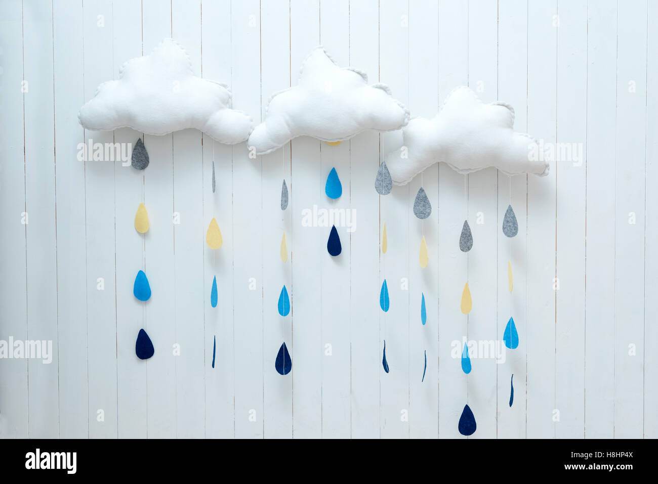 Weather symbols. Handmade room decoration clouds with rain drops ...