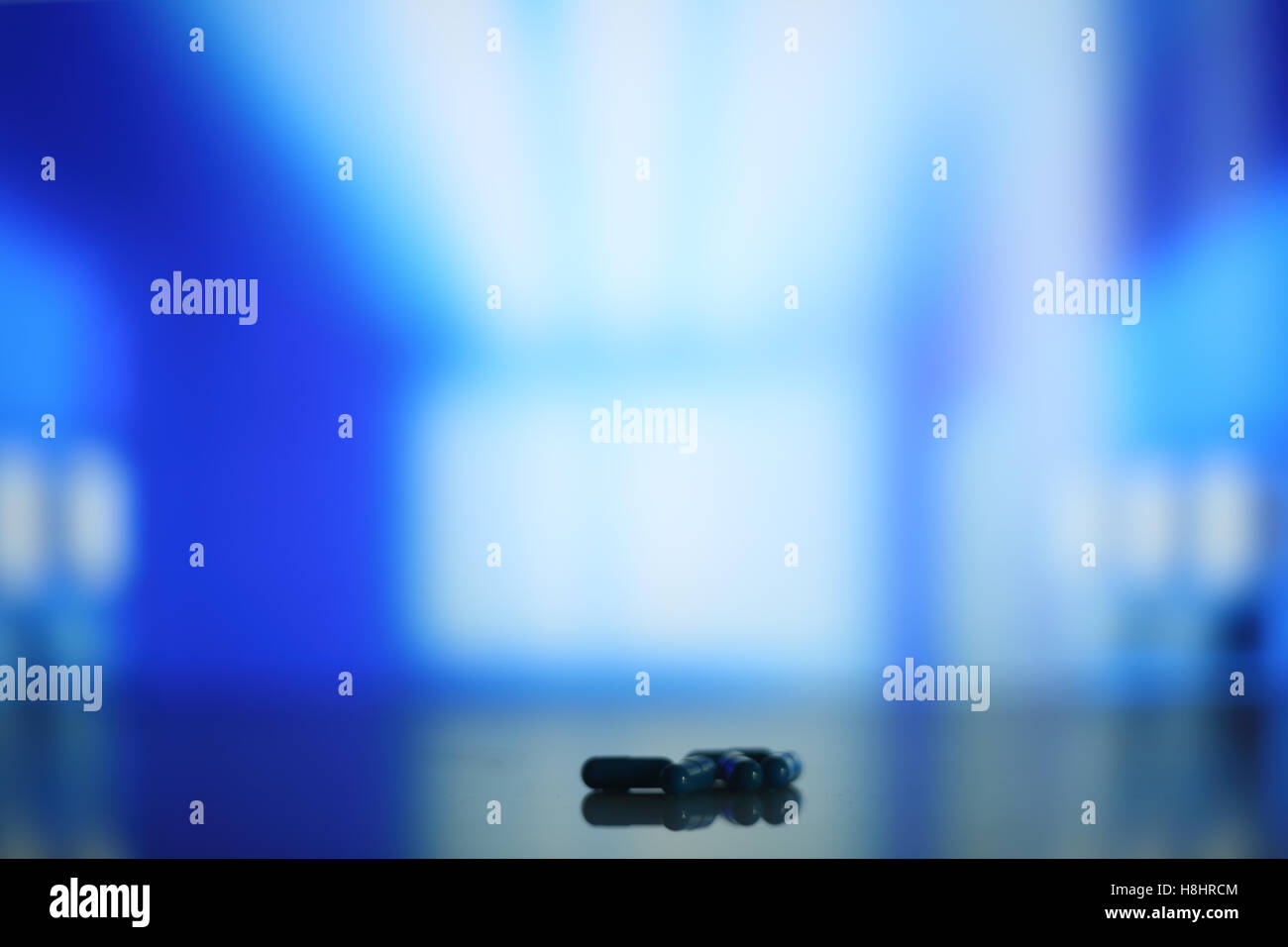 Group of vlue piils on table in hospital close up Stock Photo - Alamy