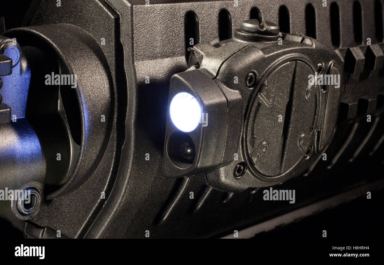 Black backup weaponlight mounted on the rails of a rifle Stock Photo ...