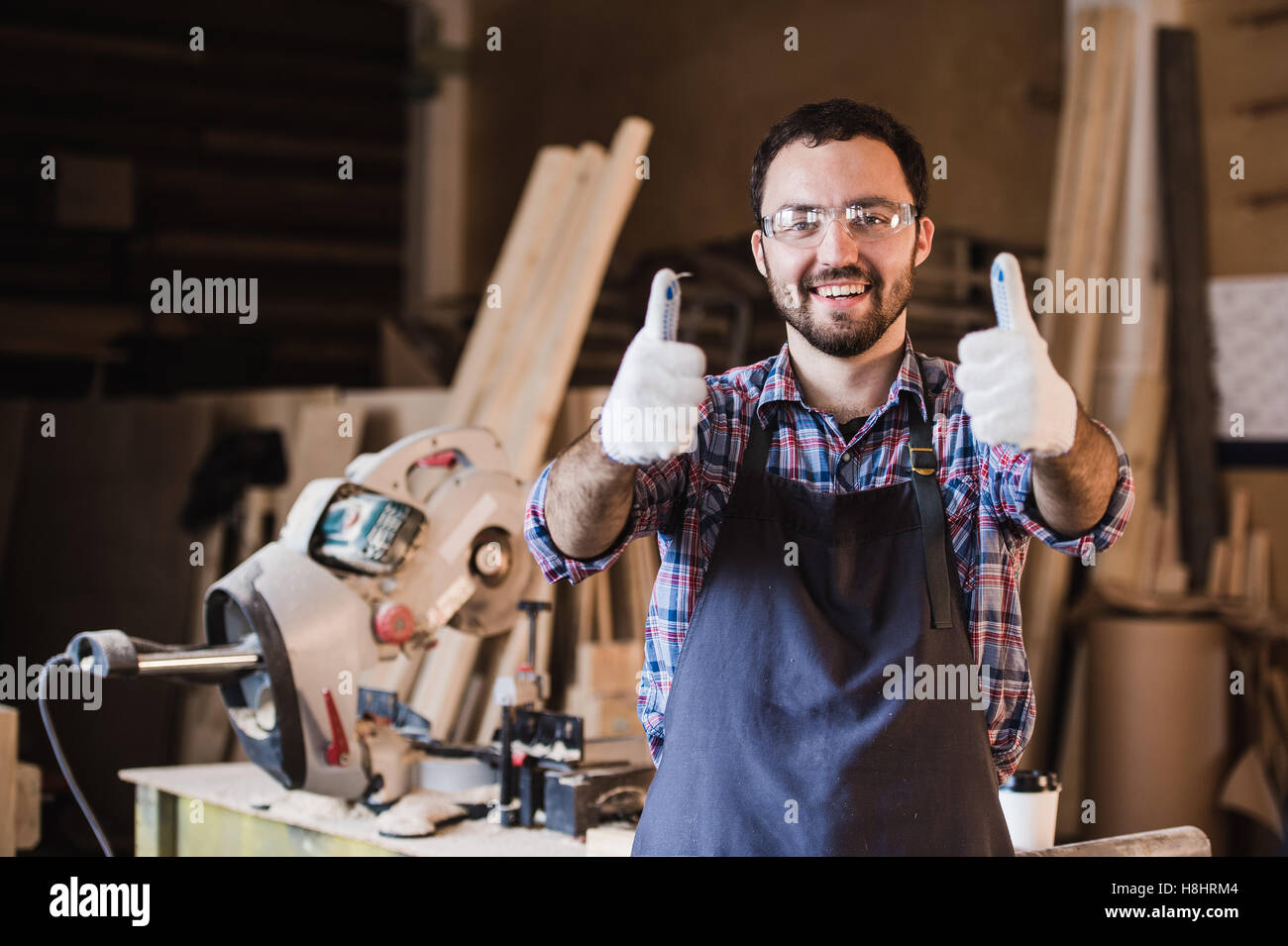 portrait of smiling construction worker thumb up Stock Photo - Alamy