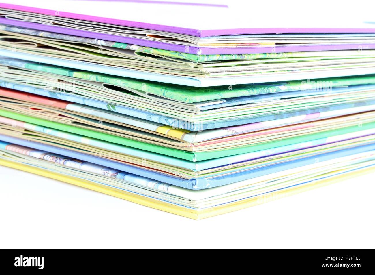 Edge of the stack of colored paper for illustration, on white ...