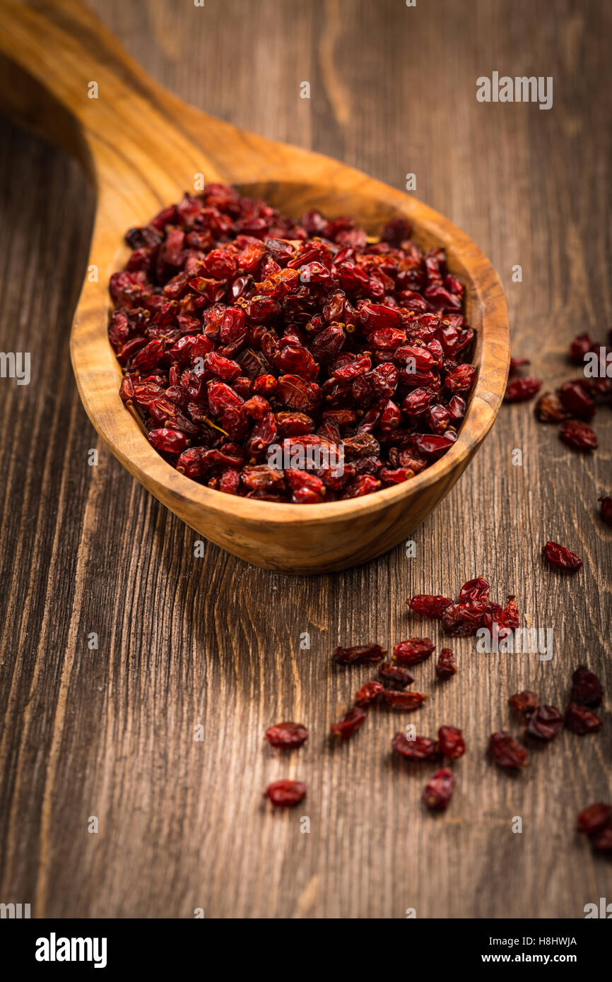 Dried Barberry (Berberis vulgaris) on wooden table Stock Photo - Alamy