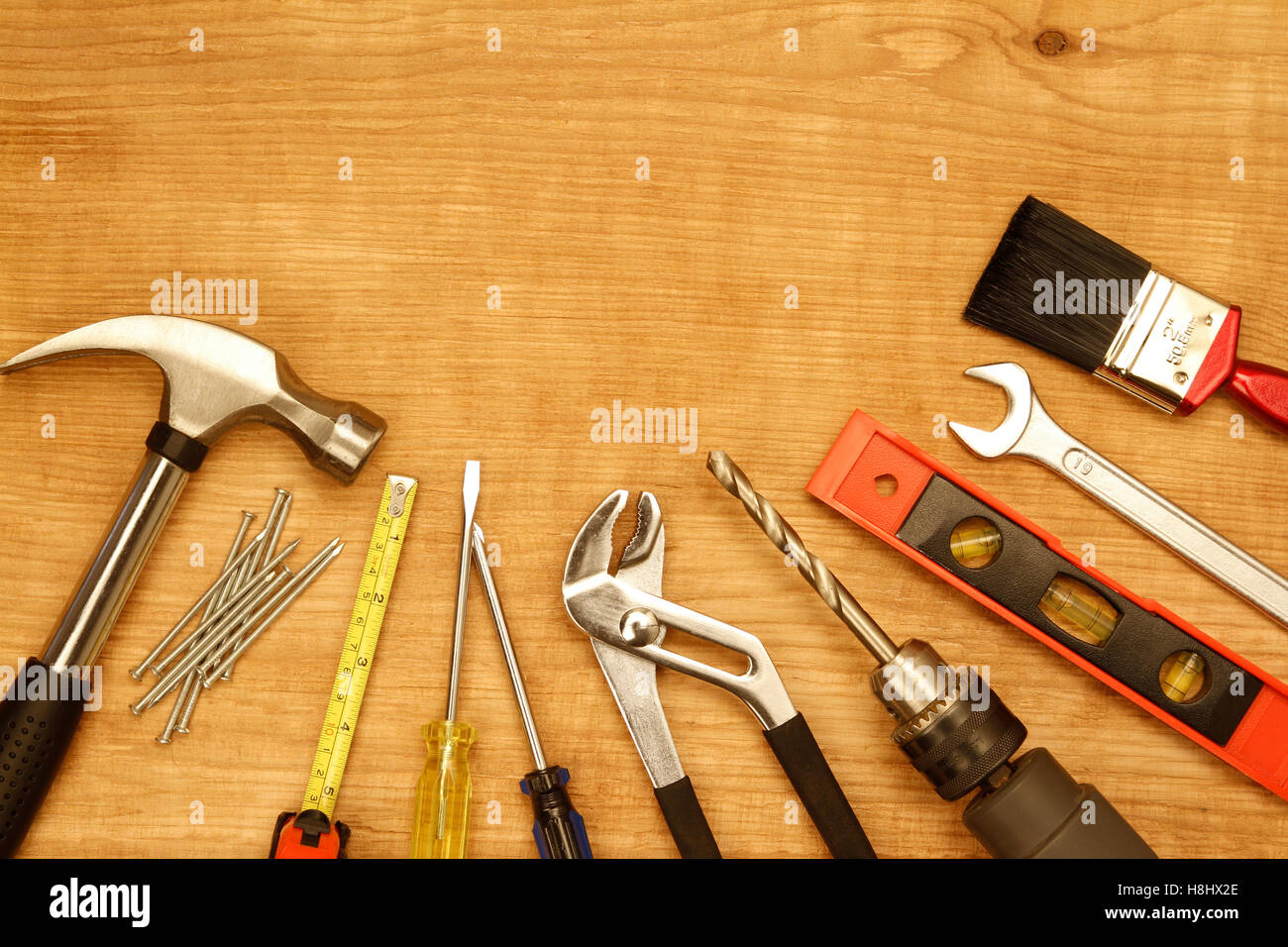 Assorted work tools on wood Stock Photo - Alamy