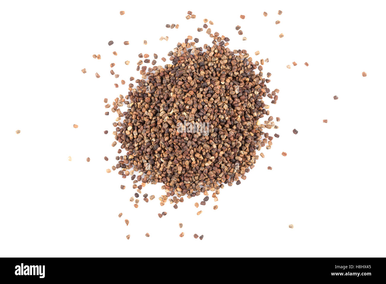 Decorticated cardamom seeds pile on a white background Stock Photo - Alamy