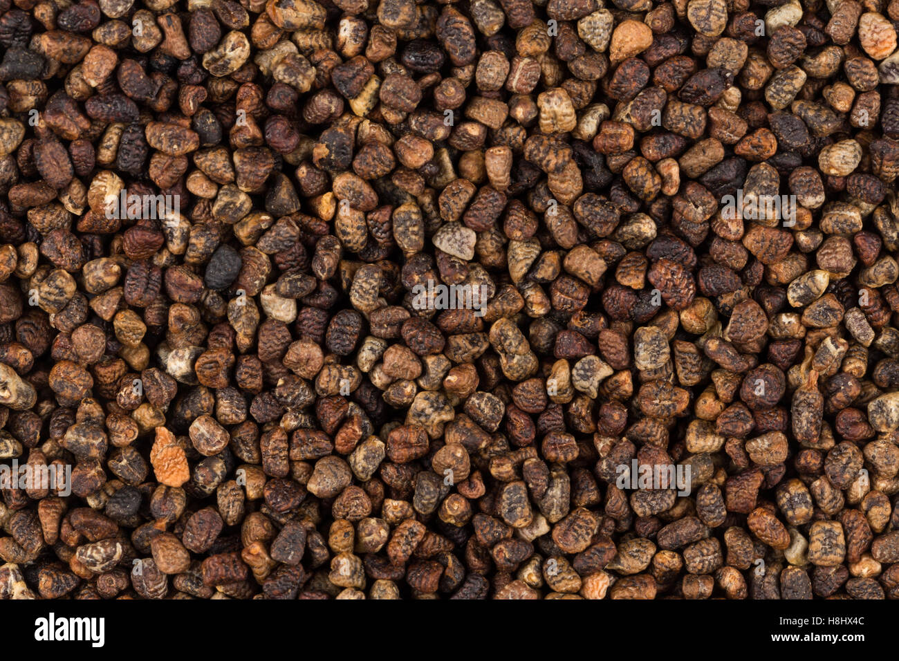 Decorticated cardamom seeds close up image can be used for background ...