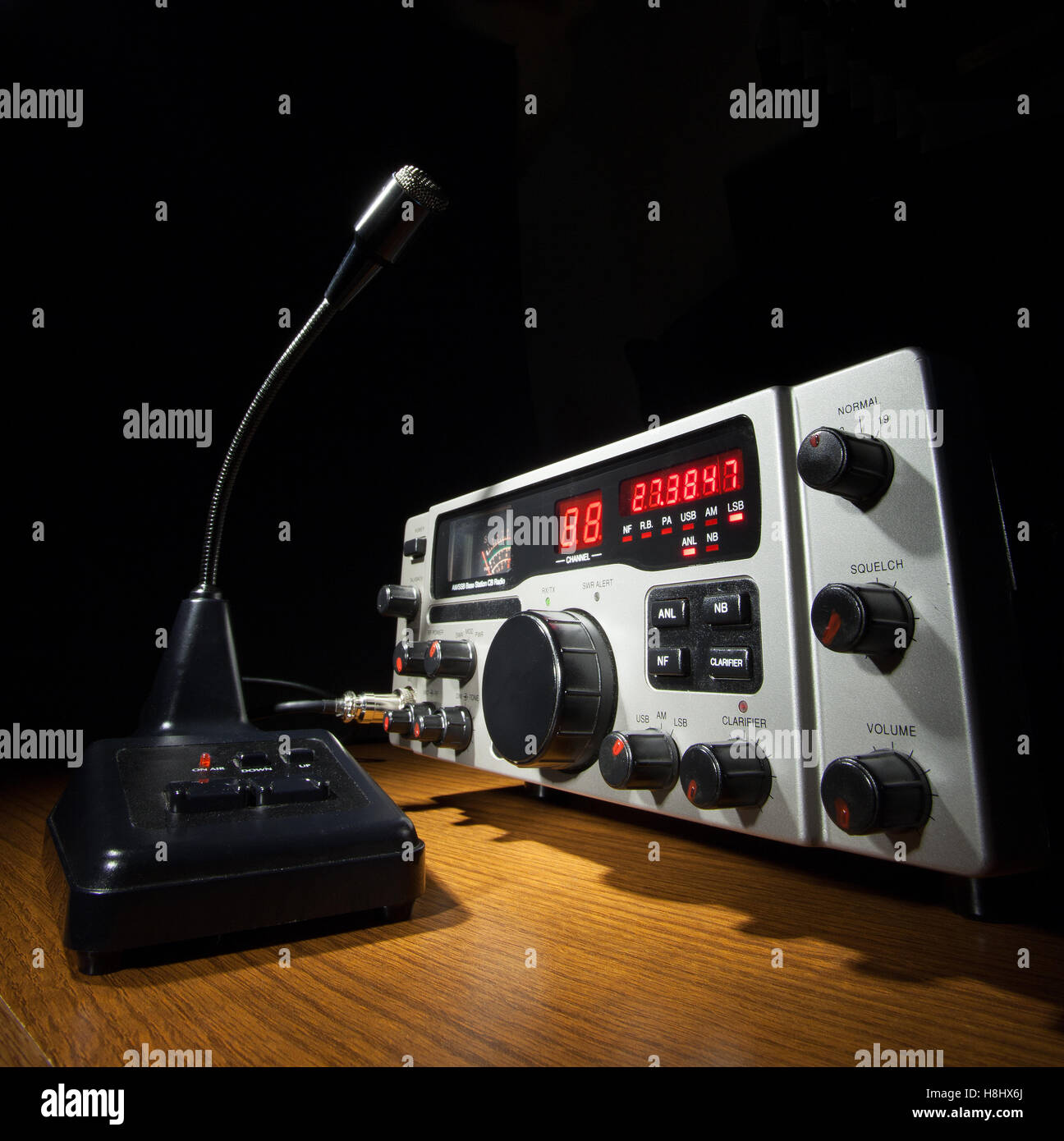 Radio with red frequency counter and microphone nearby Stock Photo - Alamy