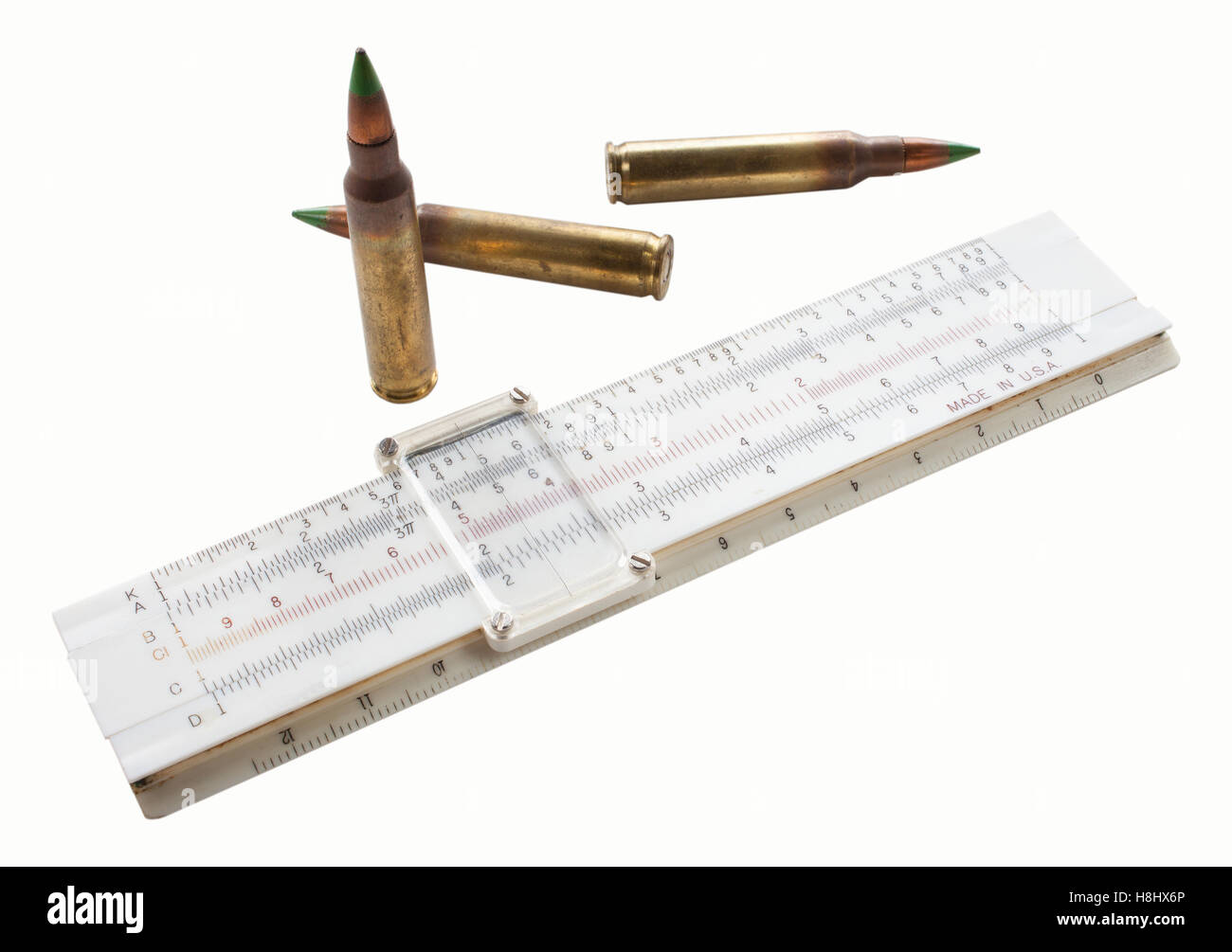 Green tipped military ammo with a slide rule isolated on white Stock ...