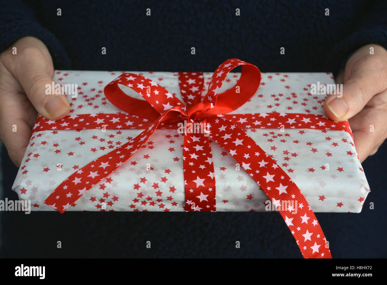 Hands giving and receiving a present hi-res stock photography and ...