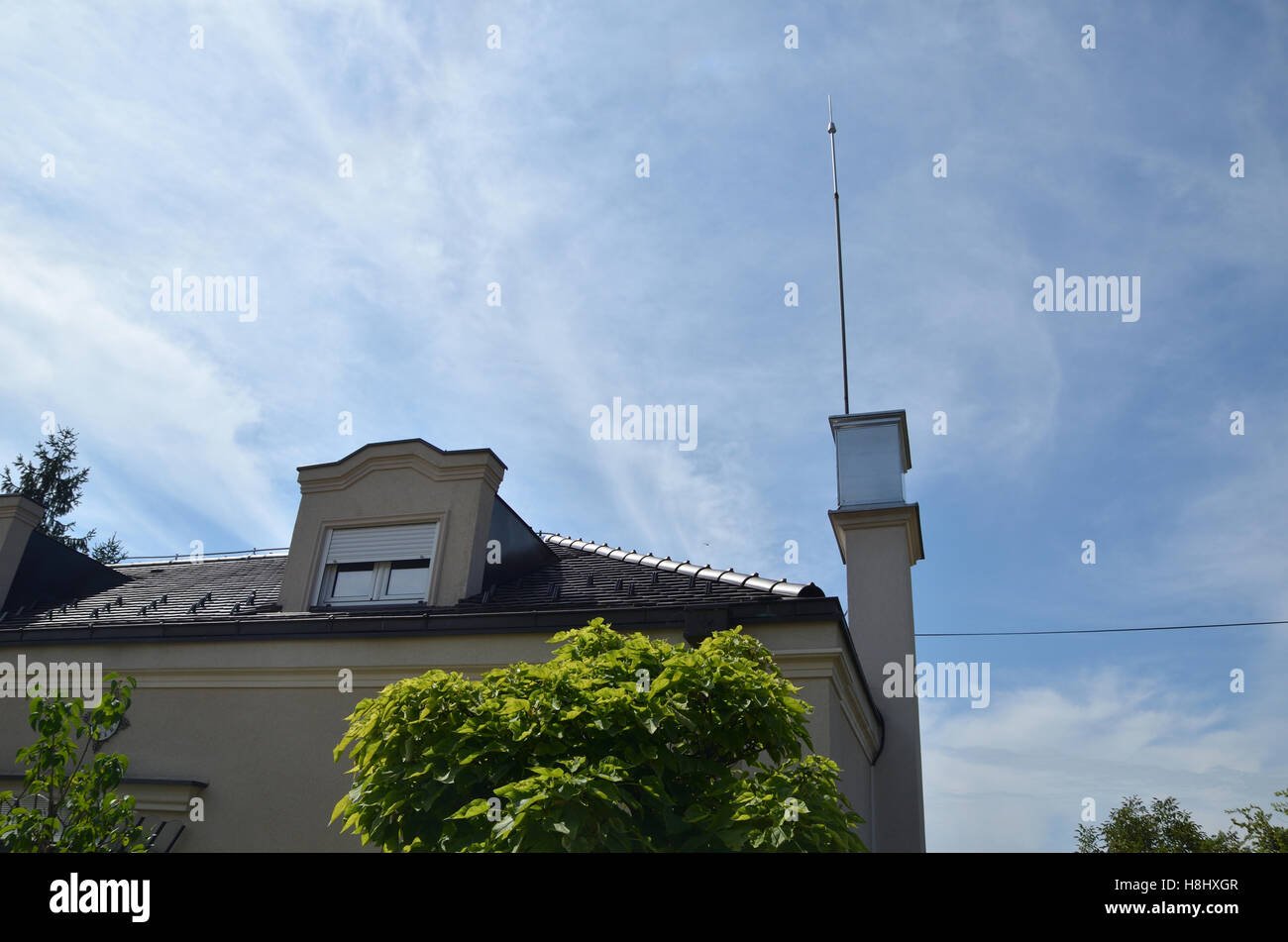 Lightning rod on the top of a building against the blue sky Stock Photo ...
