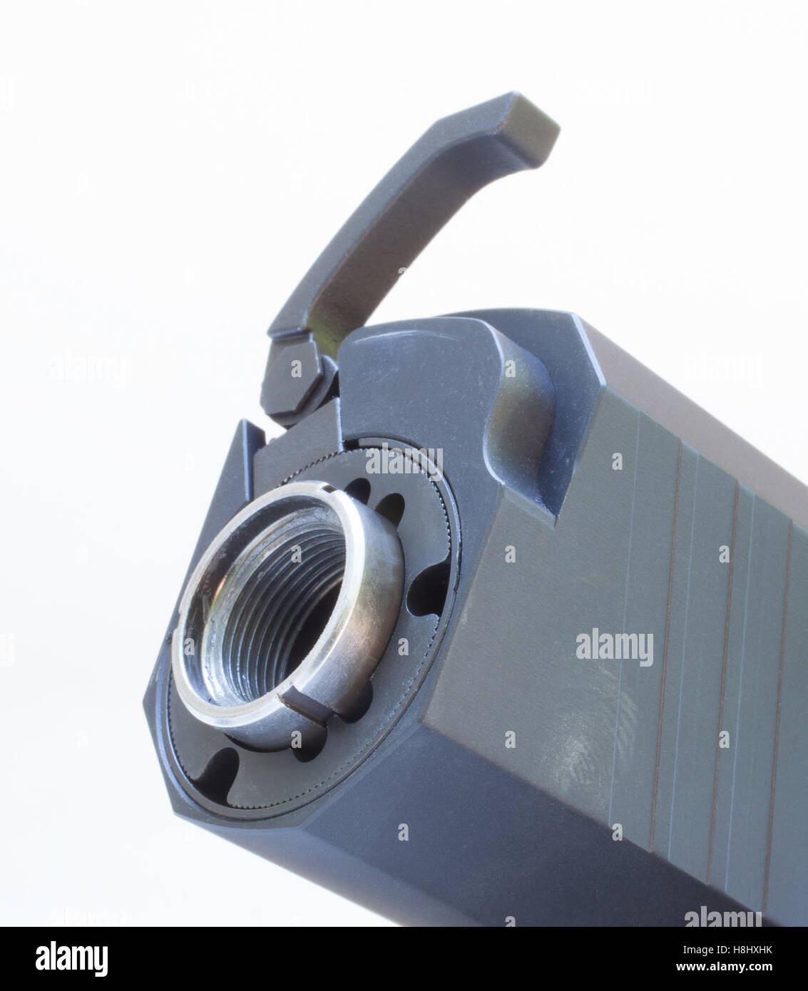 Silencer removed from a gun with its lever open Stock Photo - Alamy