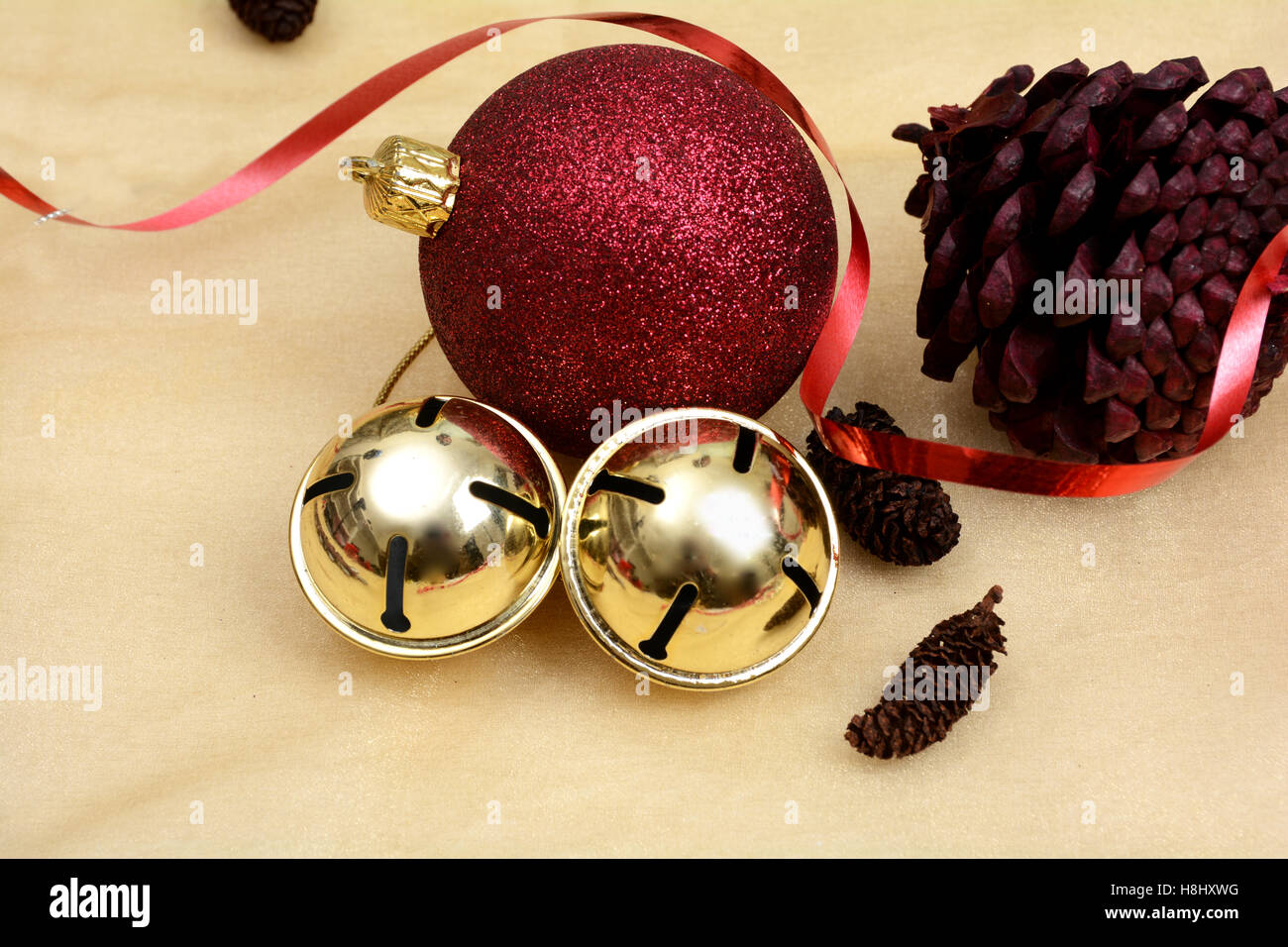 Christmas objects, pine balls and ribbon on golden background Stock ...