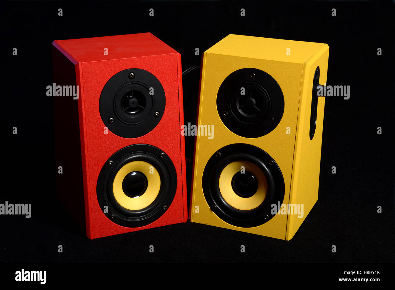Yed and Yellow Audio Speaker on black - Music Concept Stock Photo - Alamy