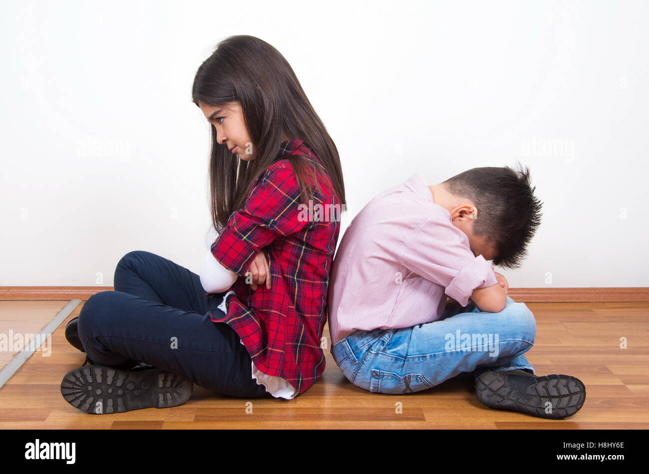 upset brother and sister together Stock Photo - Alamy